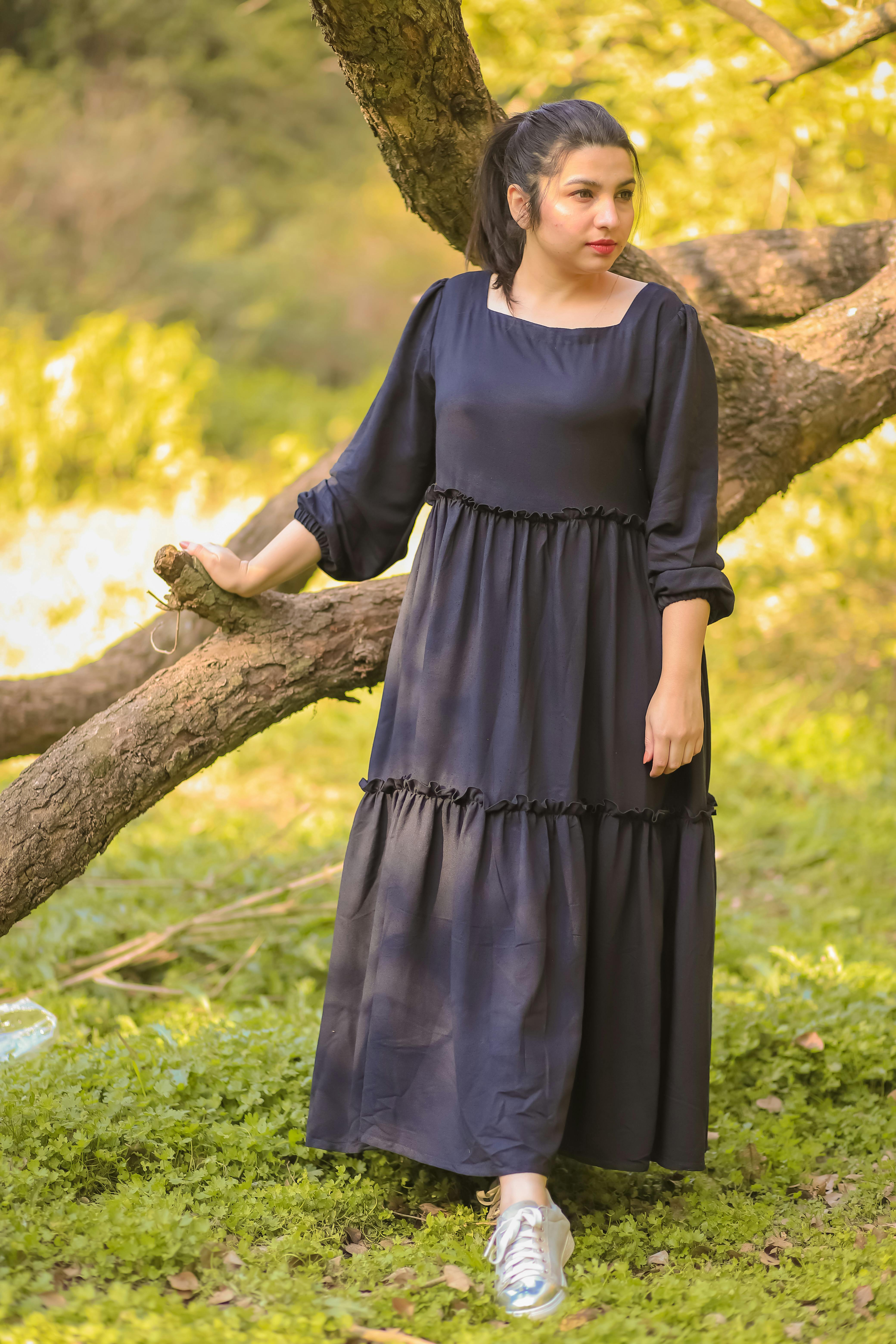 Woman Standing next to Tree · Free Stock Photo