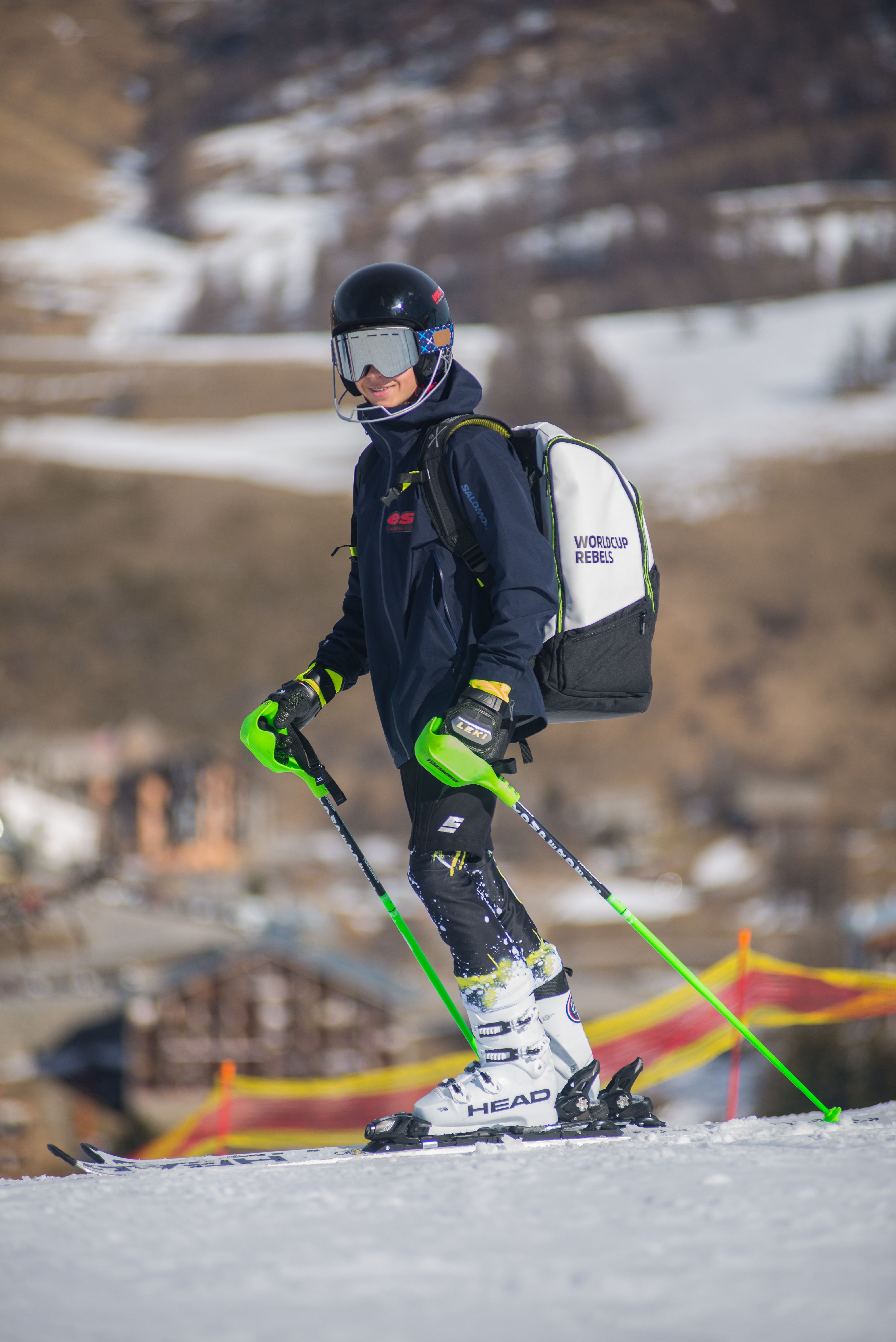 Person Going Up a Mountain with Skis on Shoulder · Free Stock Photo
