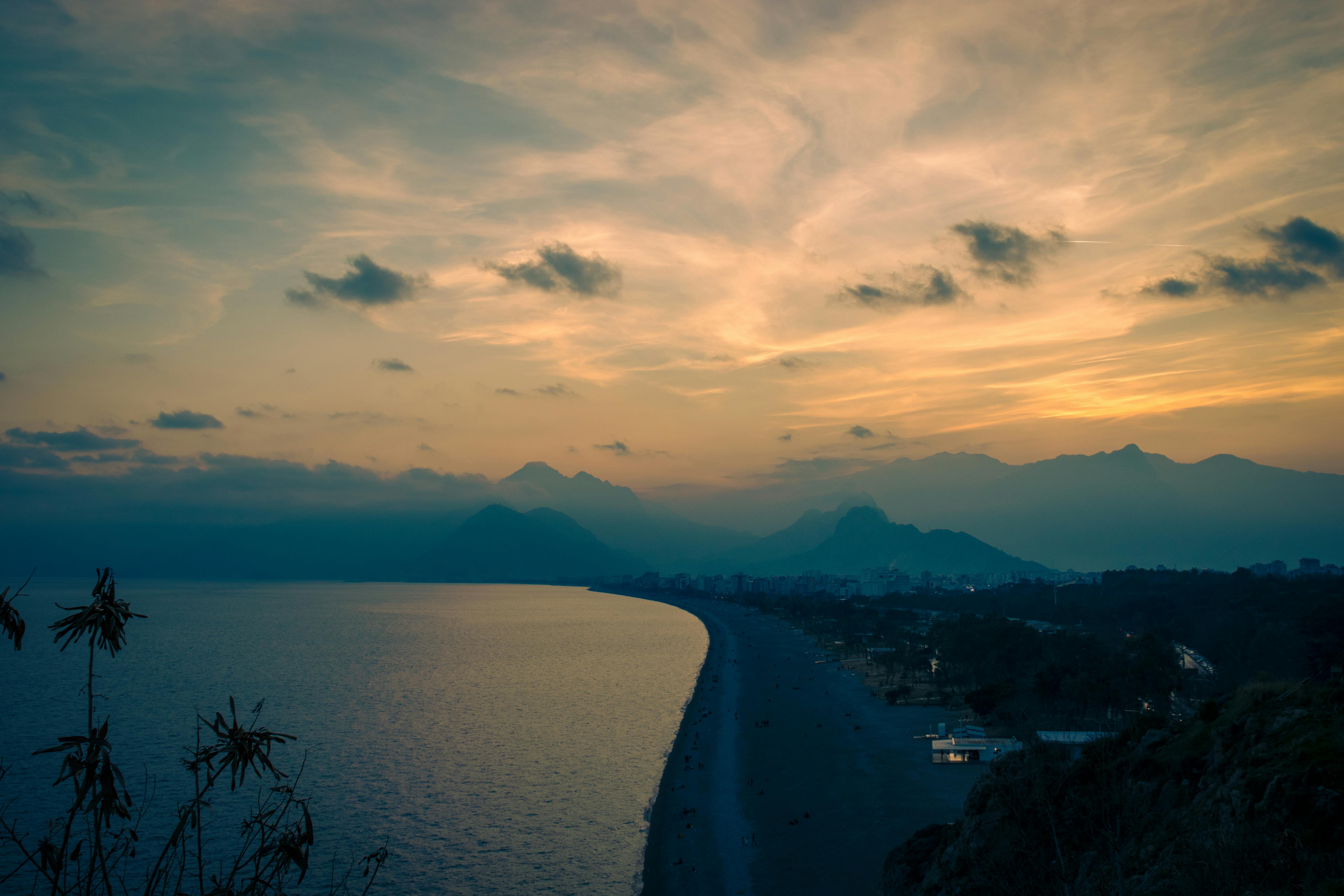 Beach and Sea Shore at Sunset · Free Stock Photo