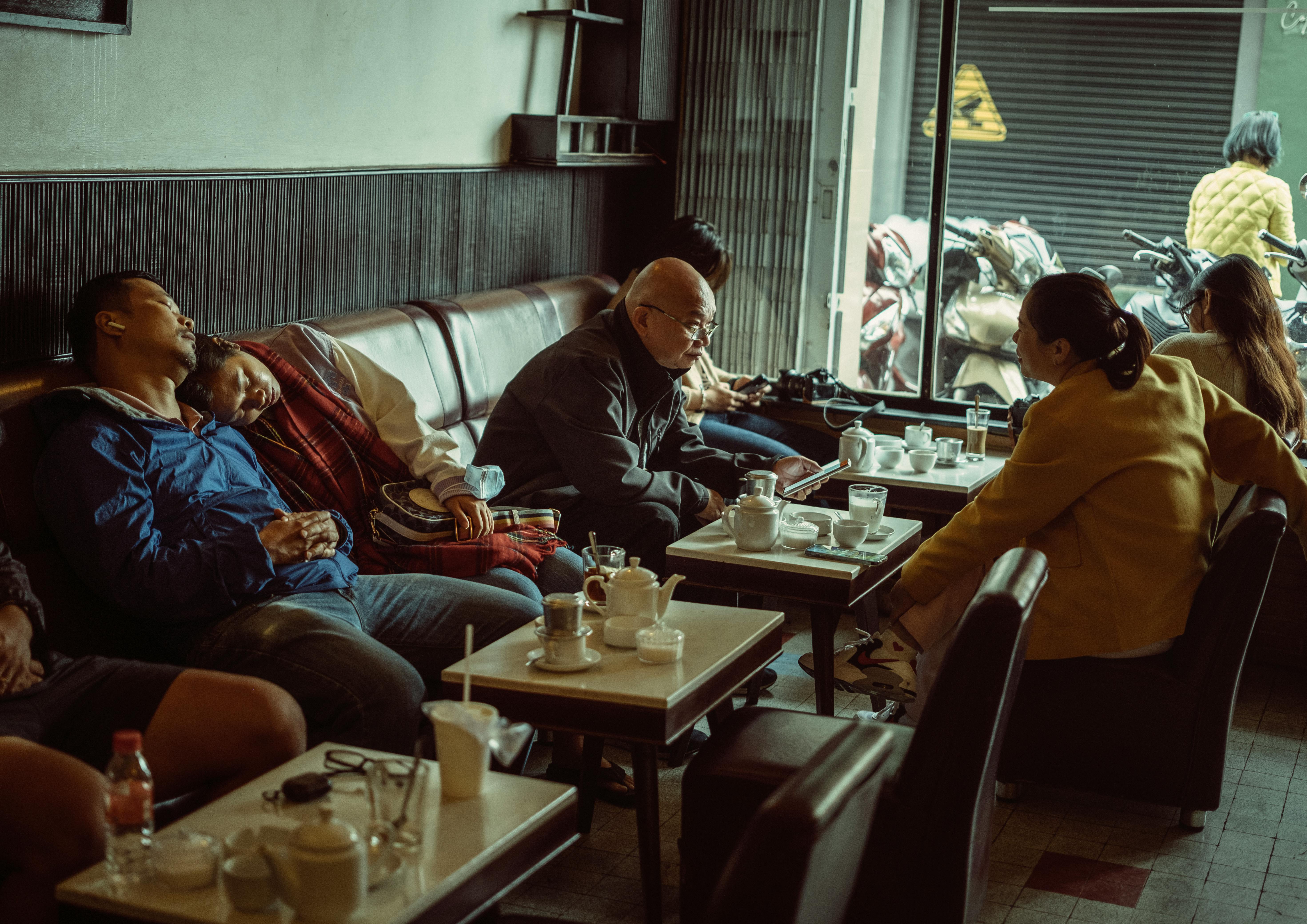 People Sitting in a Cafe · Free Stock Photo
