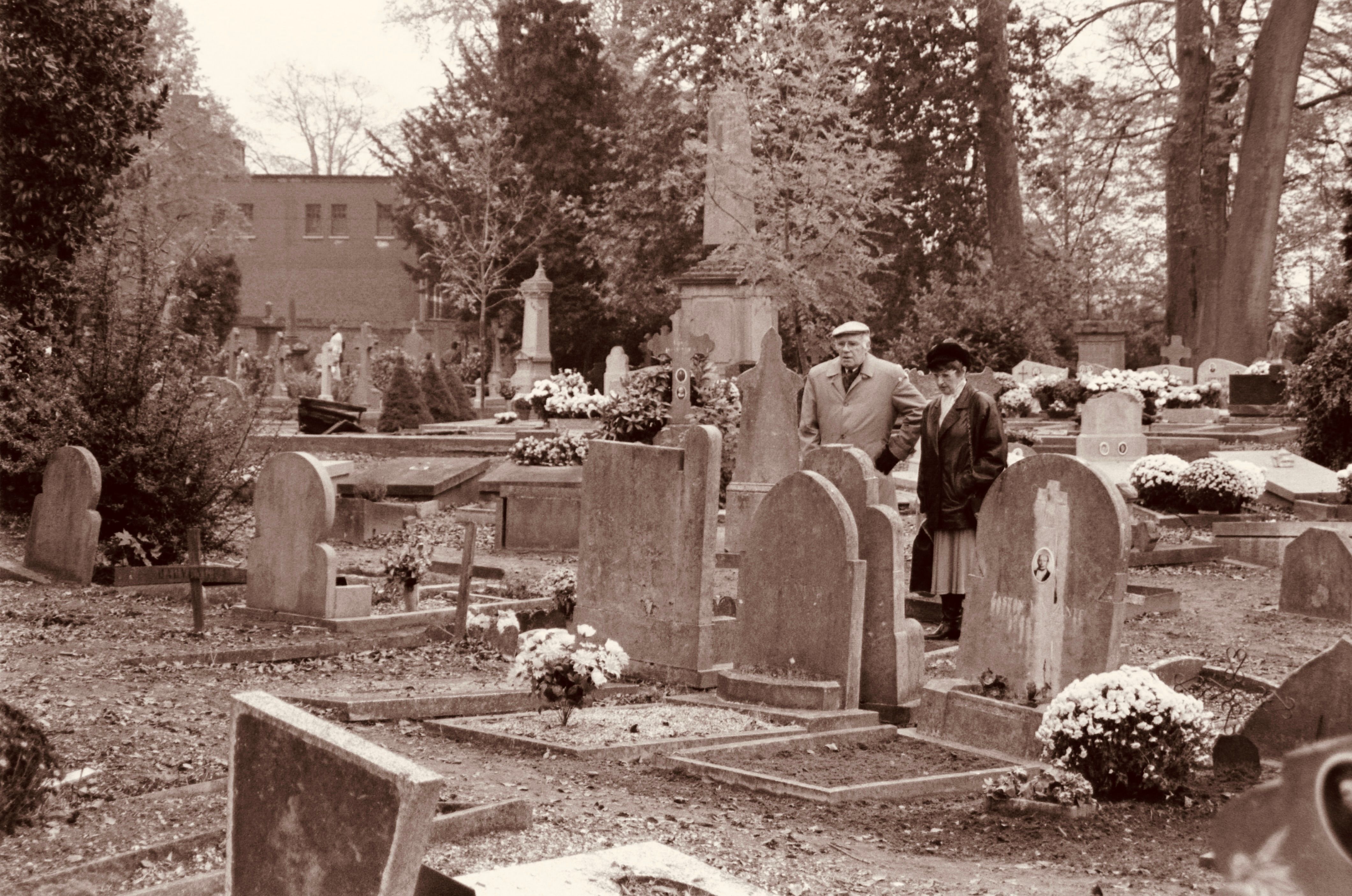 Couple Standing in the Cemetery · Free Stock Photo