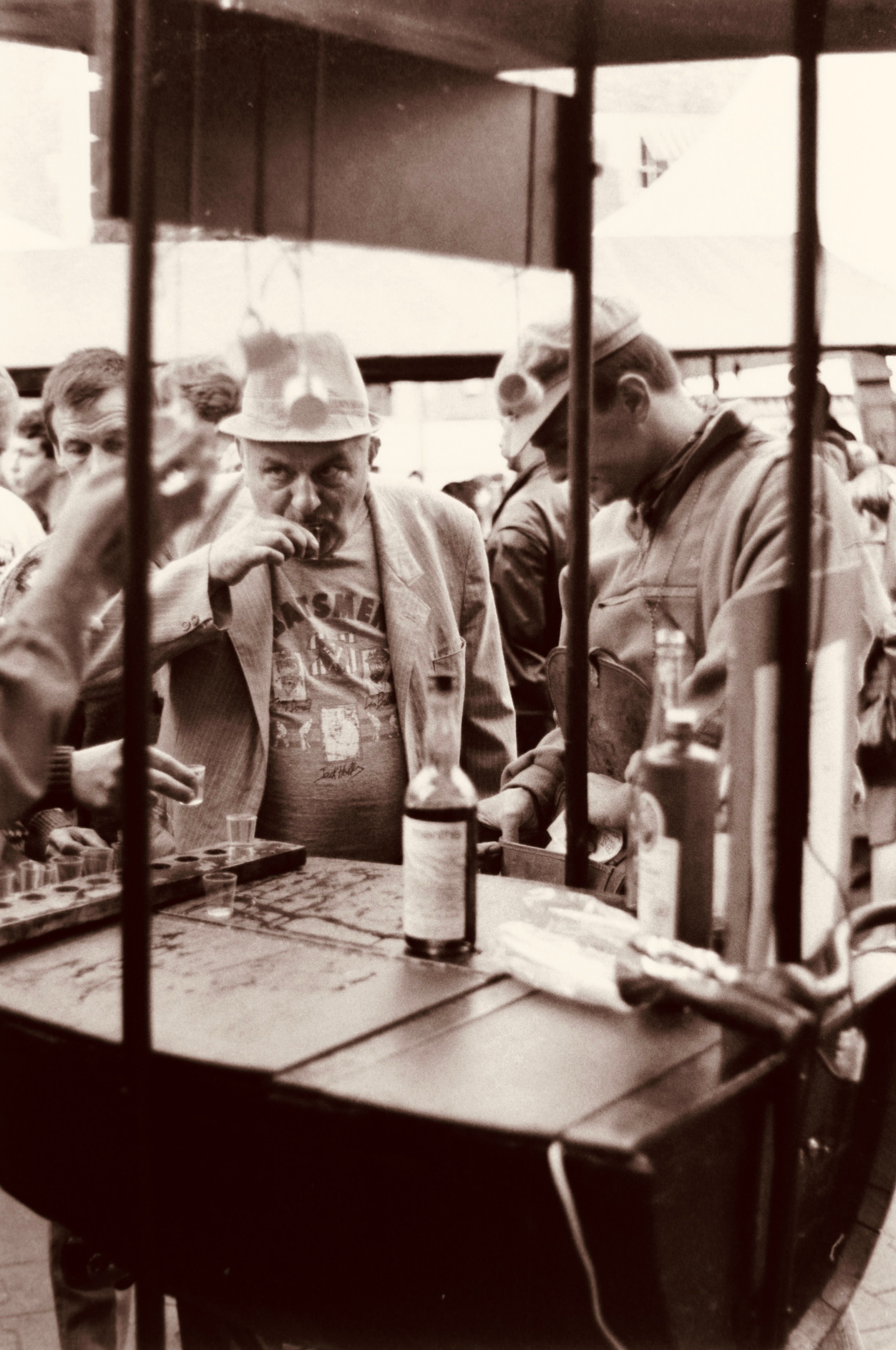 Sepia Toned Picture of Men Drinking Vodka · Free Stock Photo
