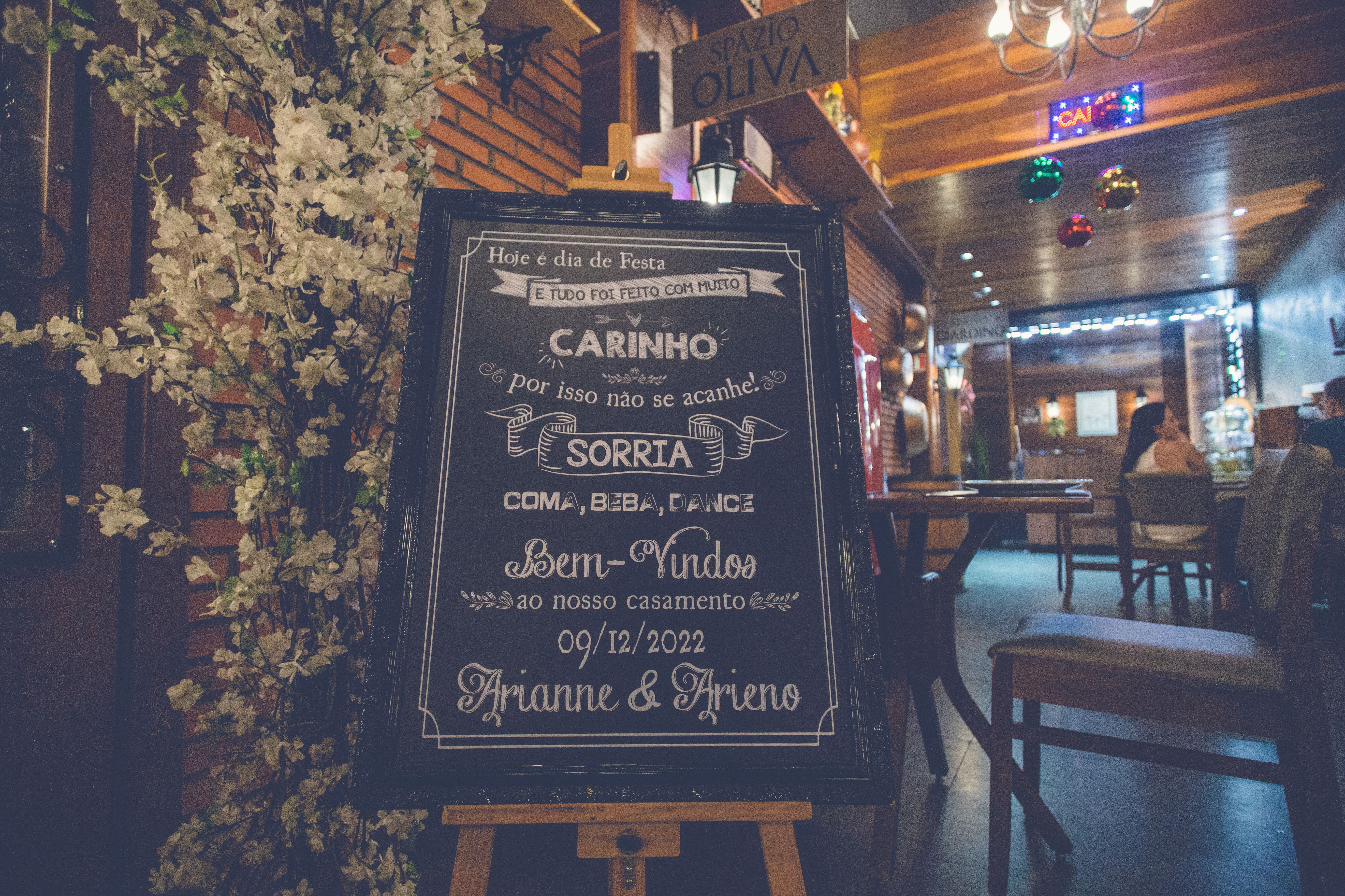 A Board at the Entrance to a Restaurant · Free Stock Photo