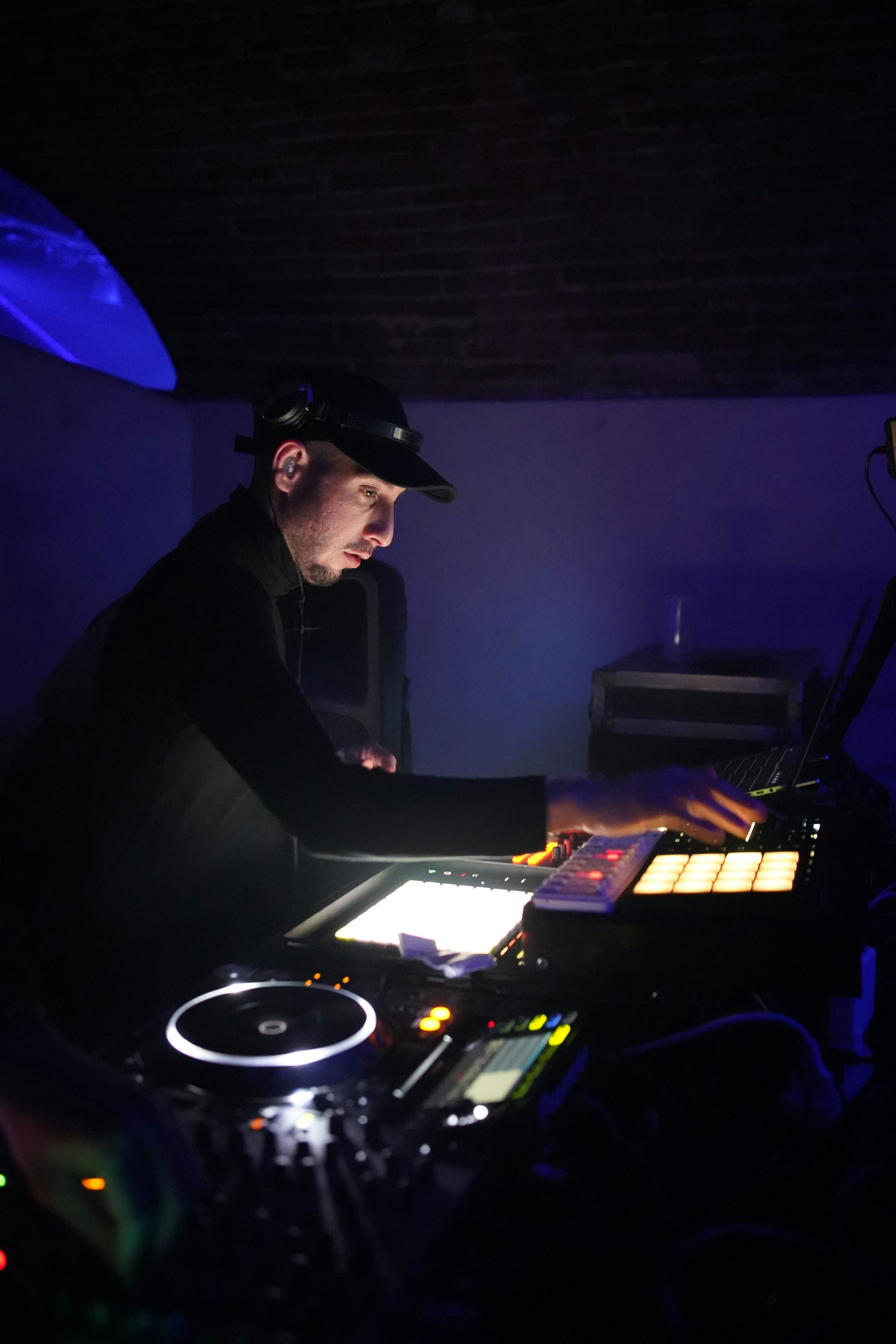 DJ Playing Music on Stage · Free Stock Photo