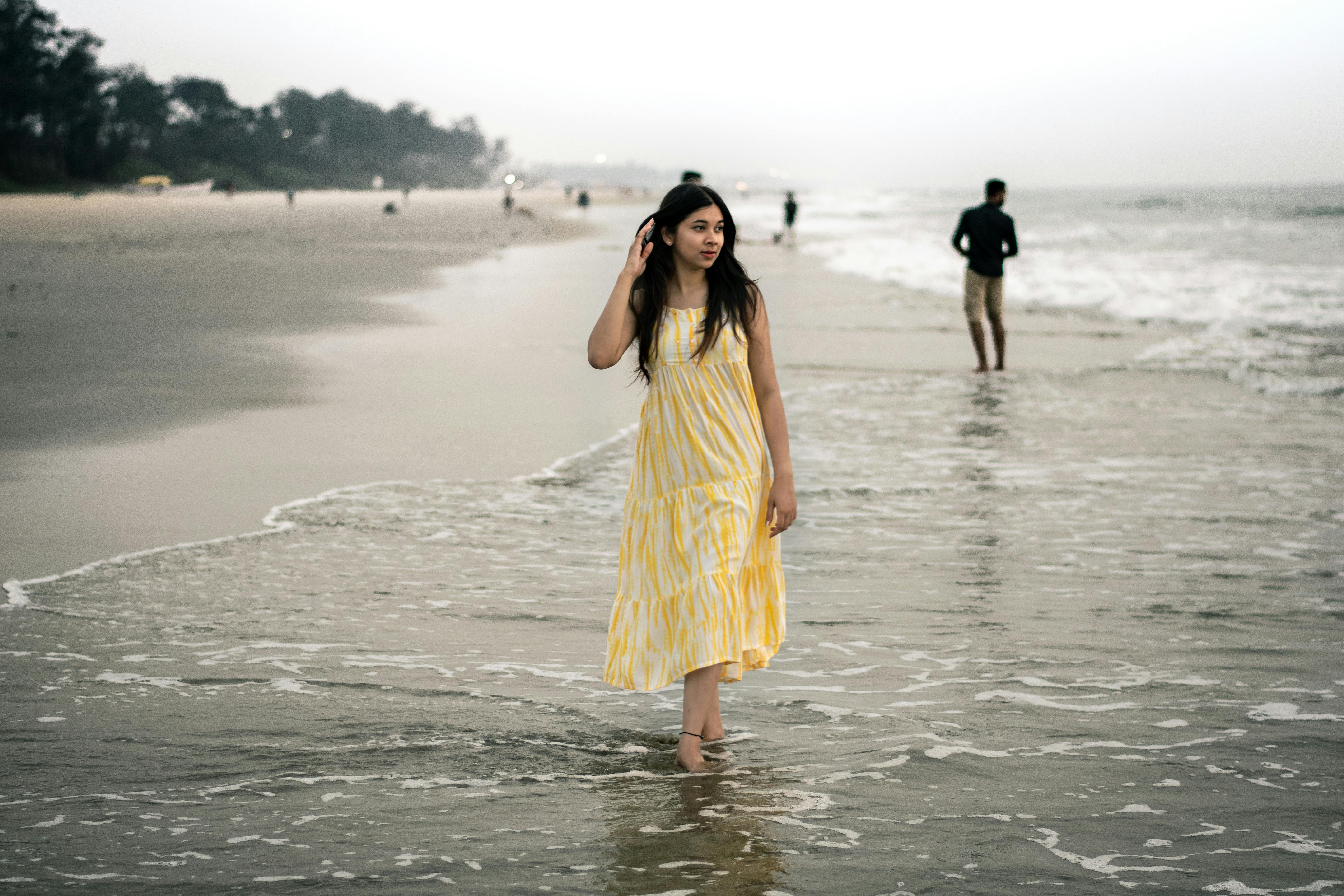 Woman Walking on the Beach · Free Stock Photo