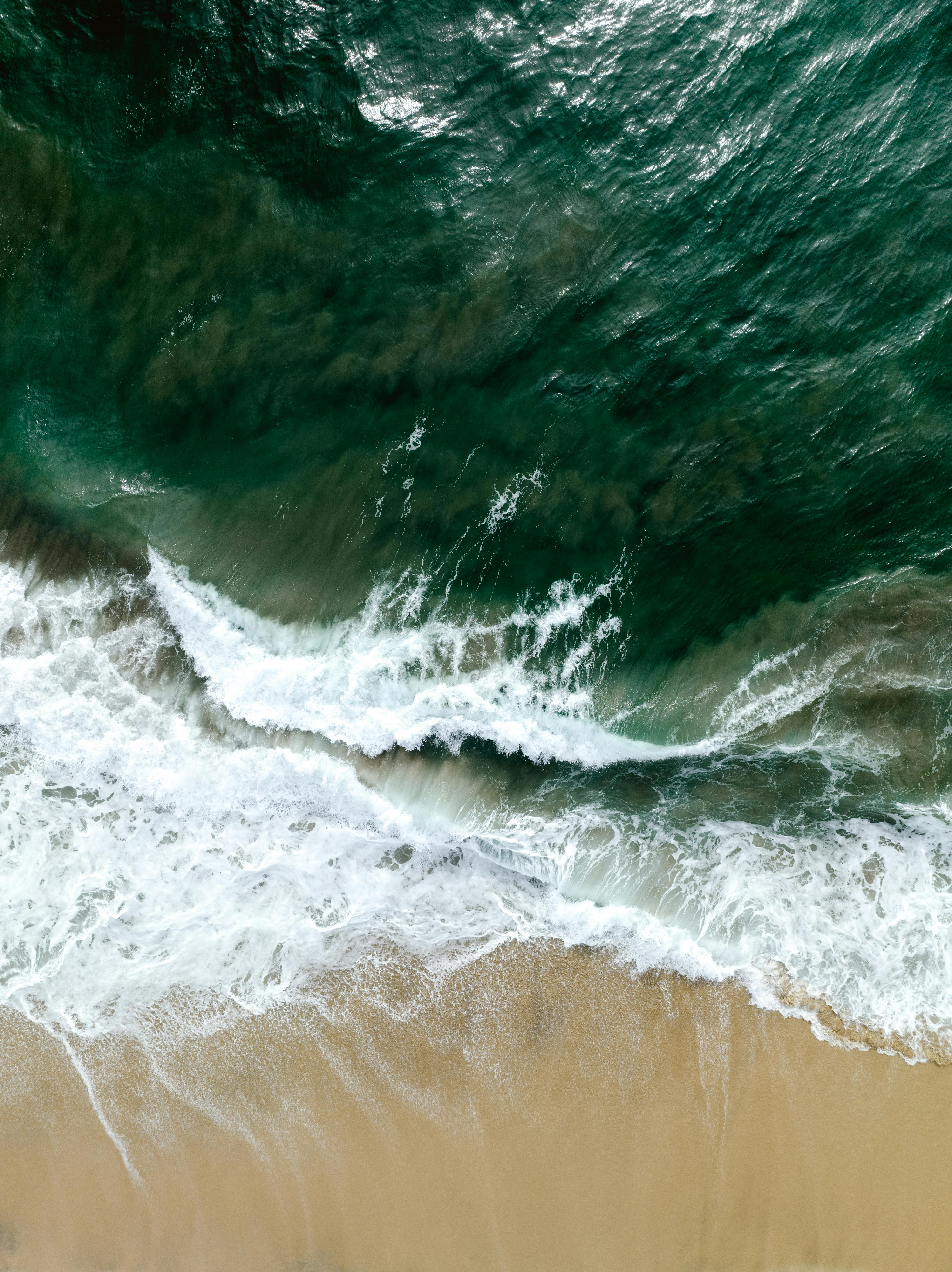 Aerial View of Waves Washing up the Beach · Free Stock Photo