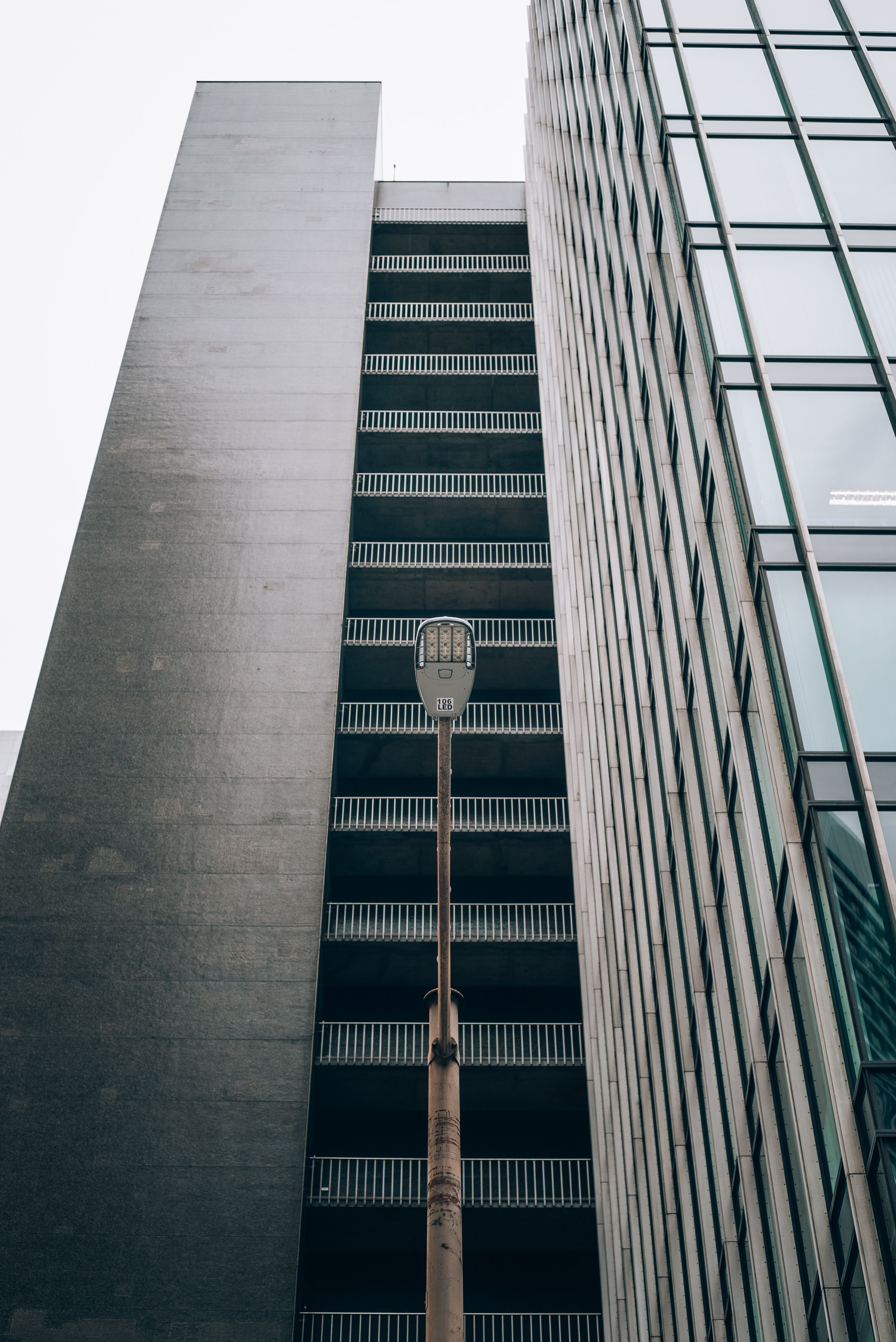 A street light is next to tall buildings · Free Stock Photo