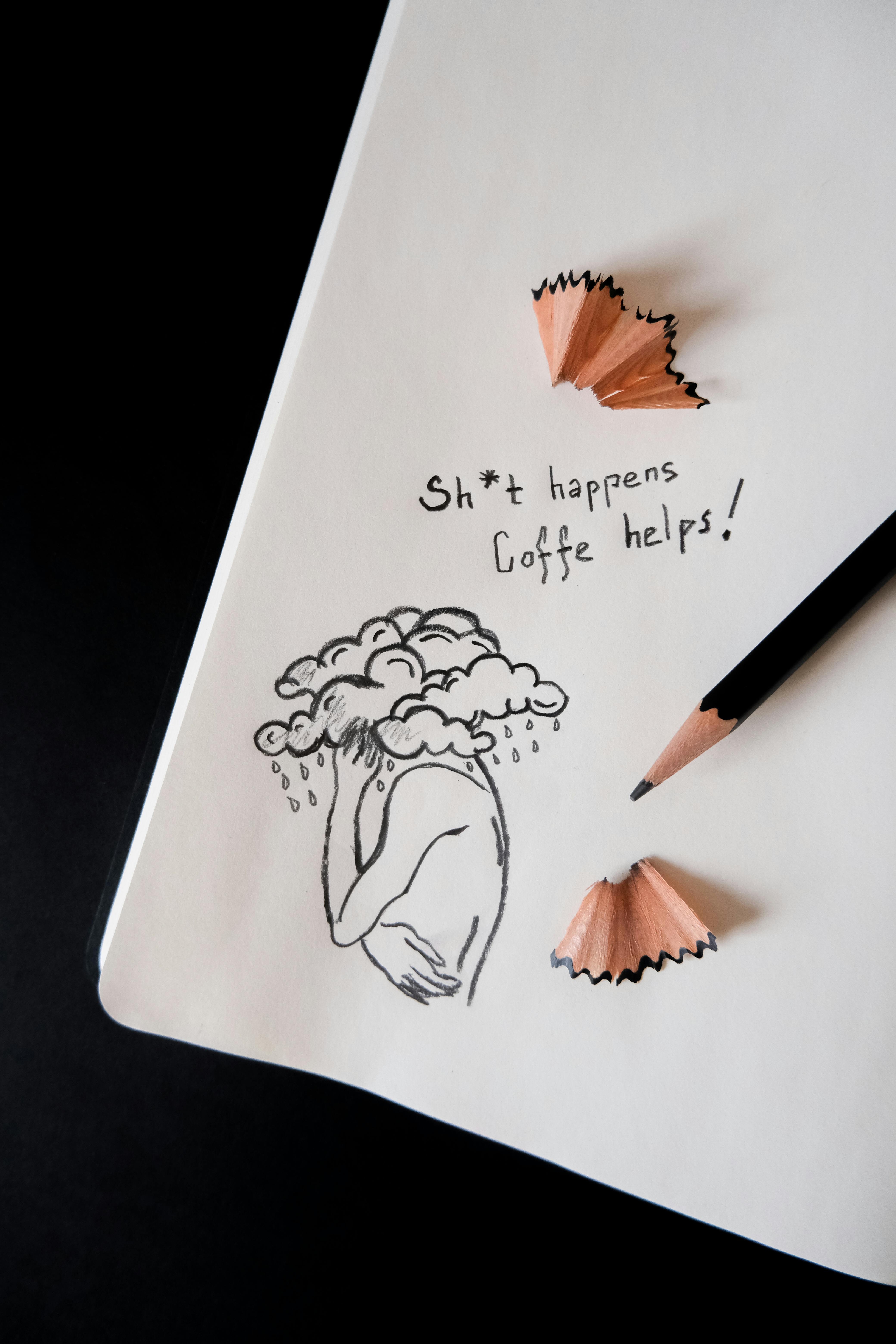 A Person Drawing on the Paper · Free Stock Photo