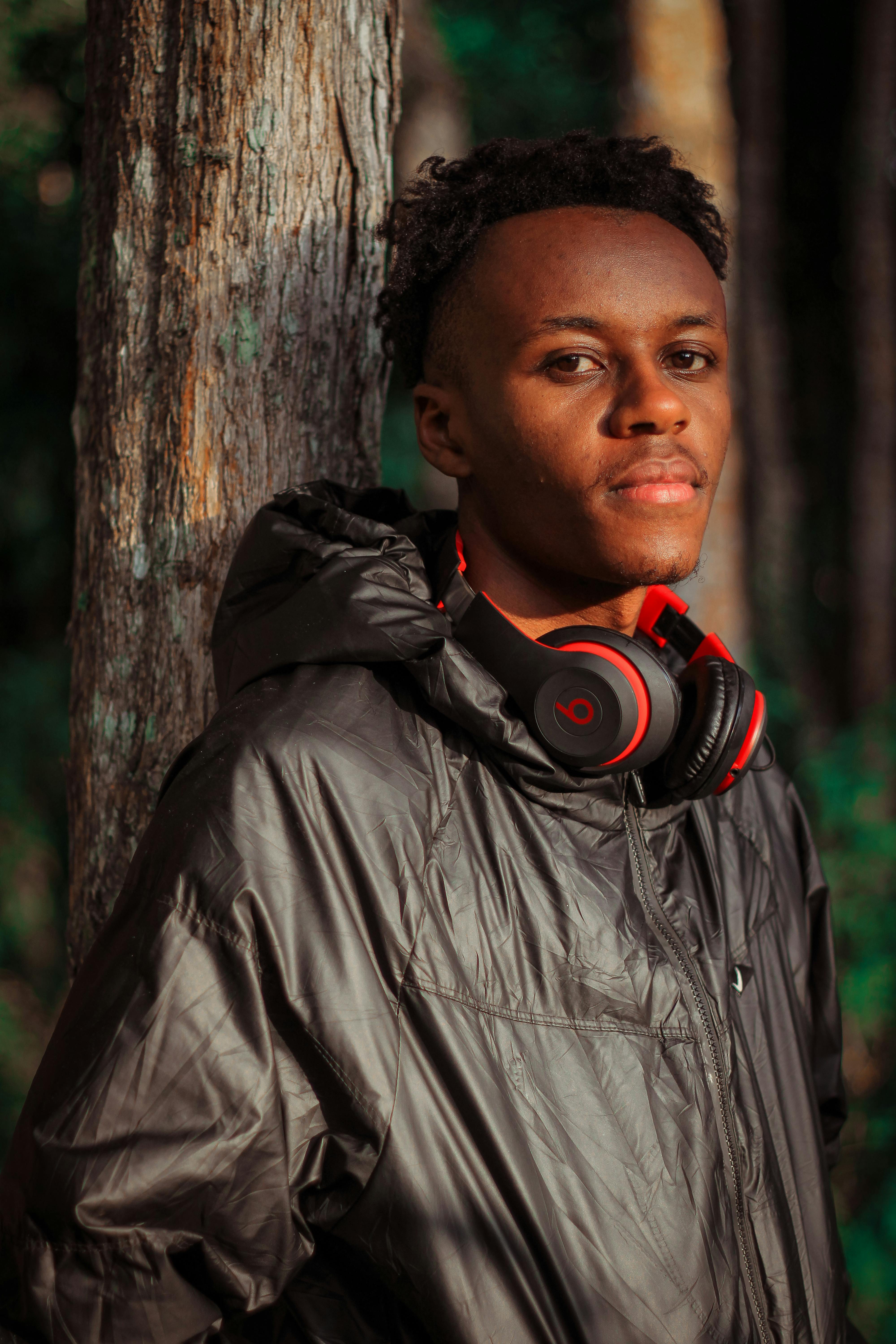 Portrait of Man in Jacket and Headphones · Free Stock Photo