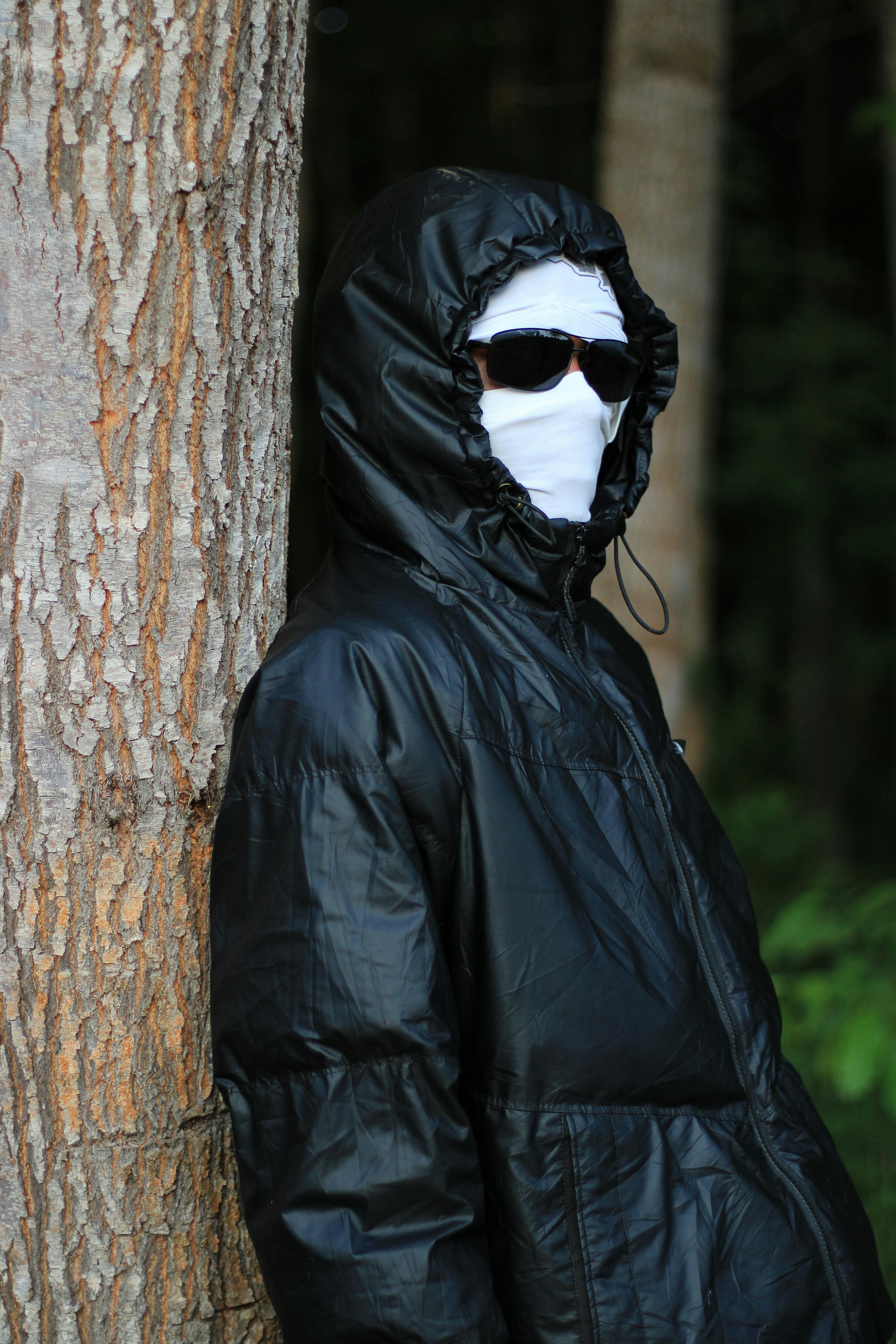 Person in Black Jacket with Hood and Sunglasses · Free Stock Photo