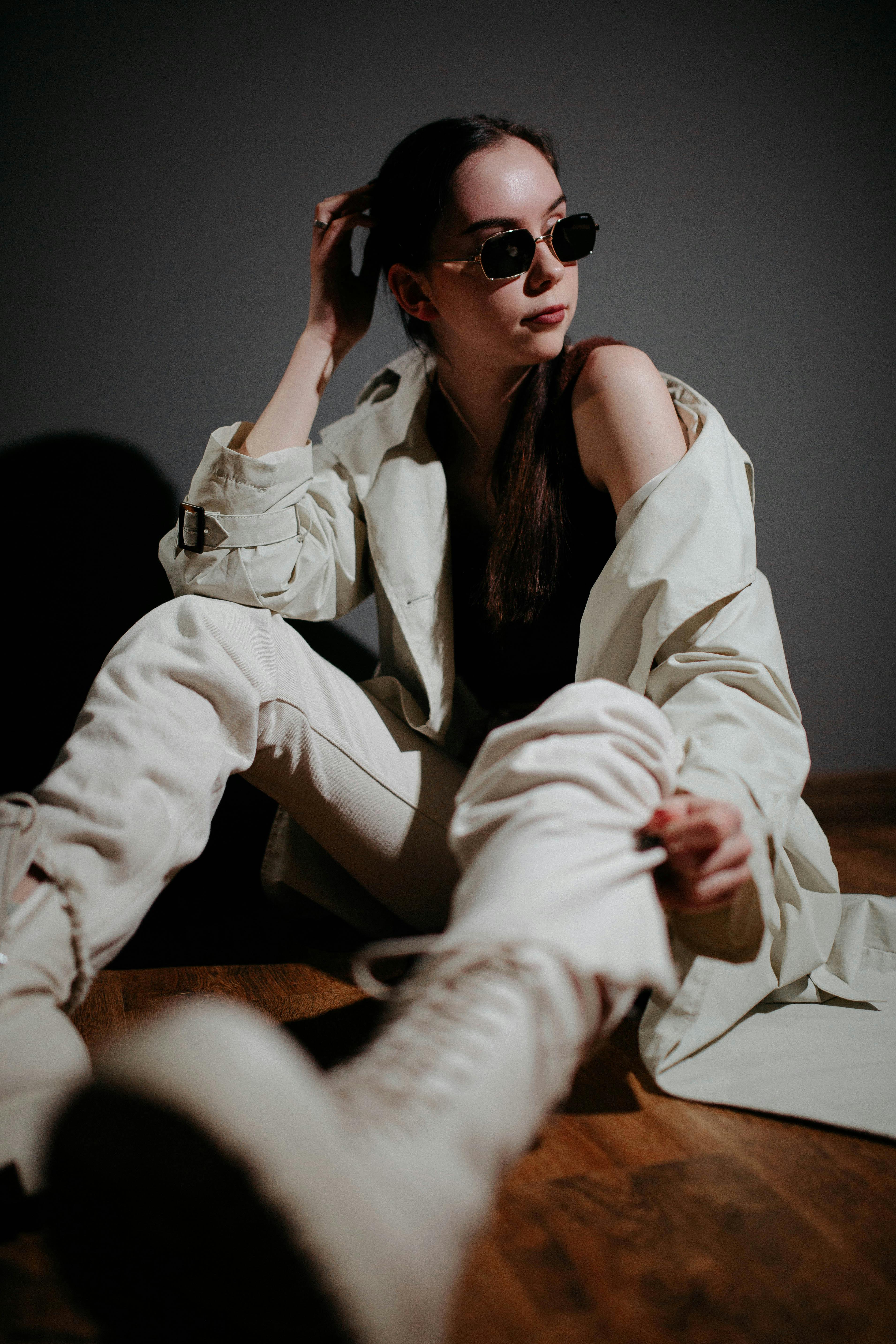 Stylish Woman in Sunglasses Sitting on Floor Posing · Free Stock Photo
