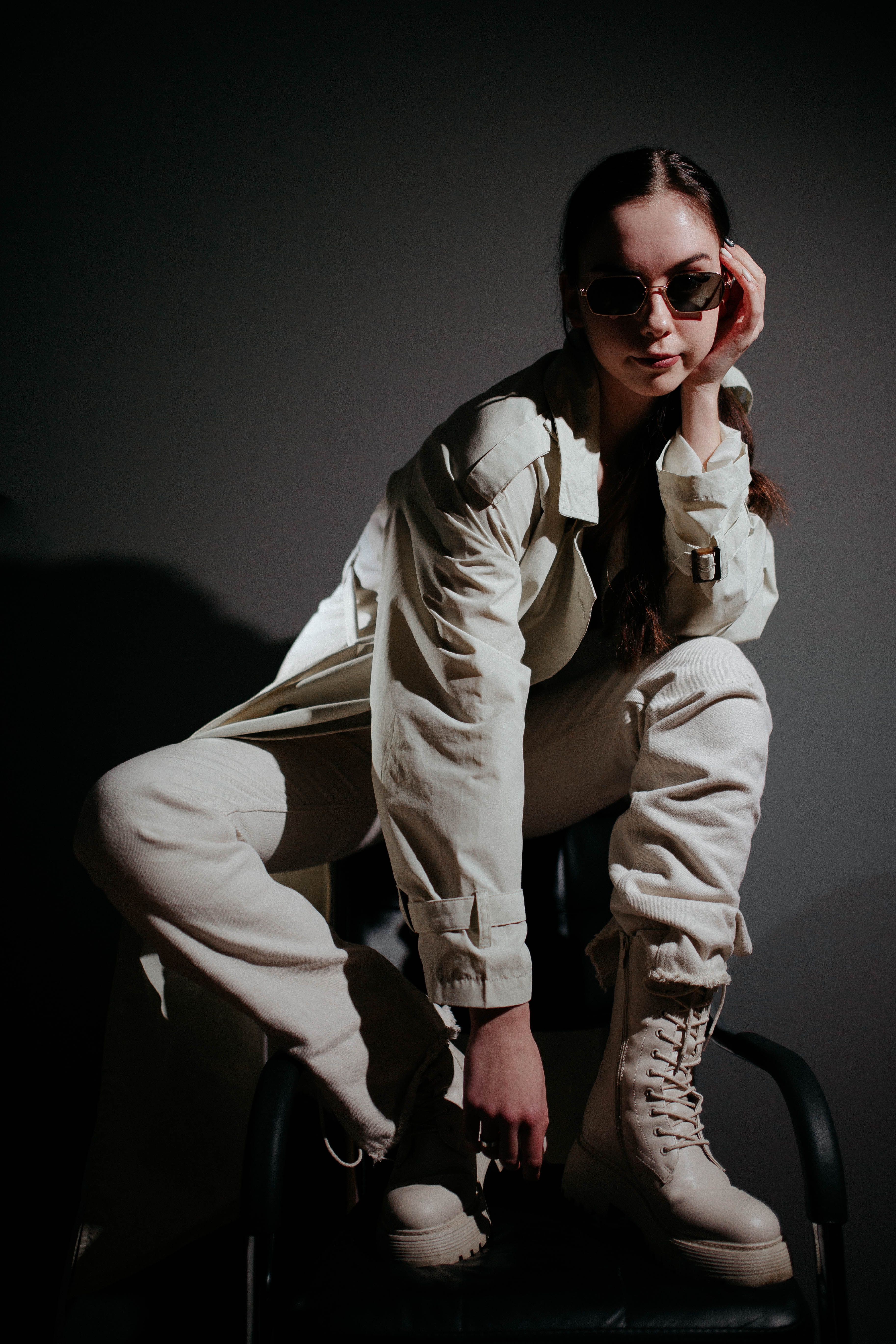 Woman in a Contemporary Outfit and Sunglasses Posing in Studio · Free ...