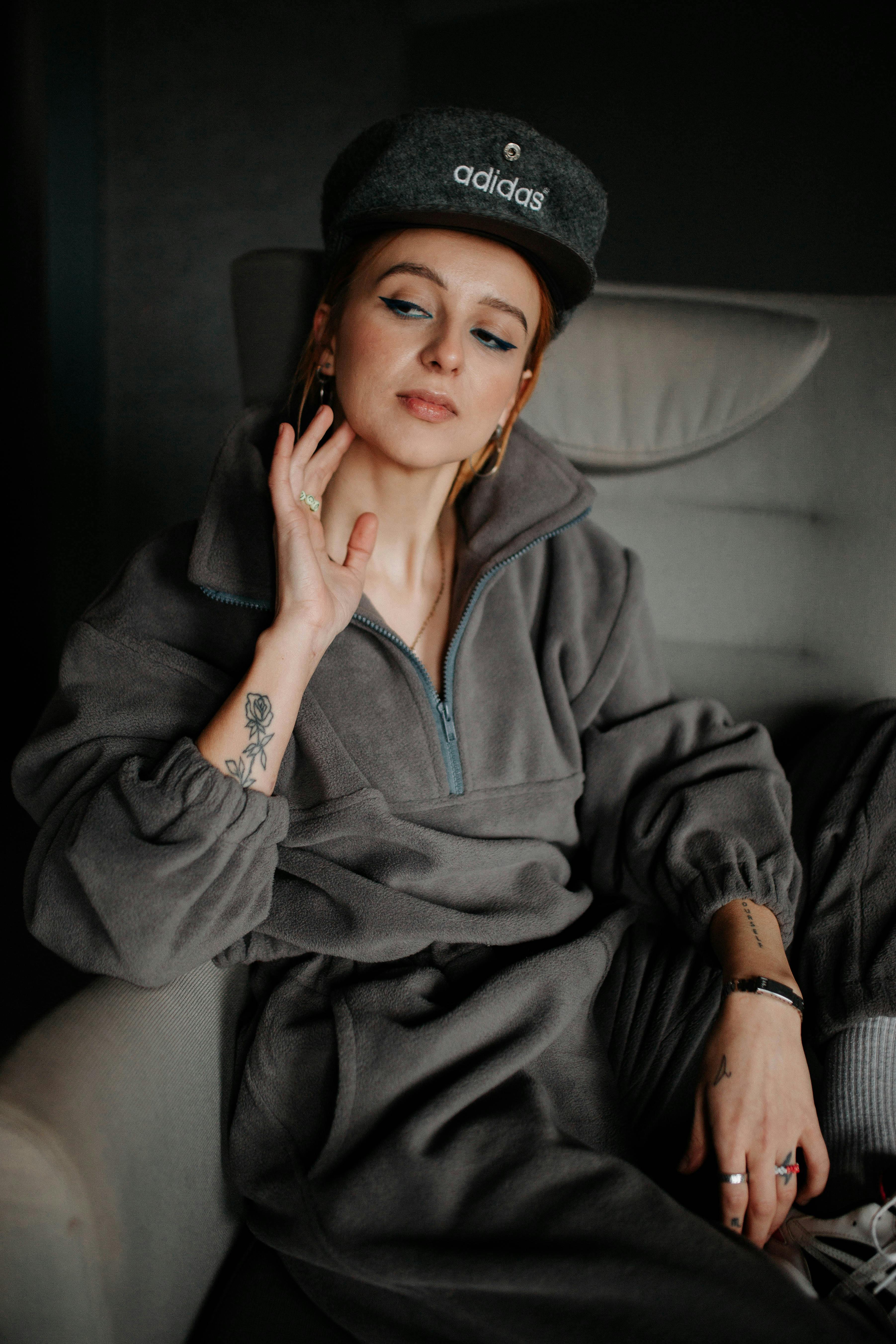 Woman Posing on Chair in Empty Classroom · Free Stock Photo