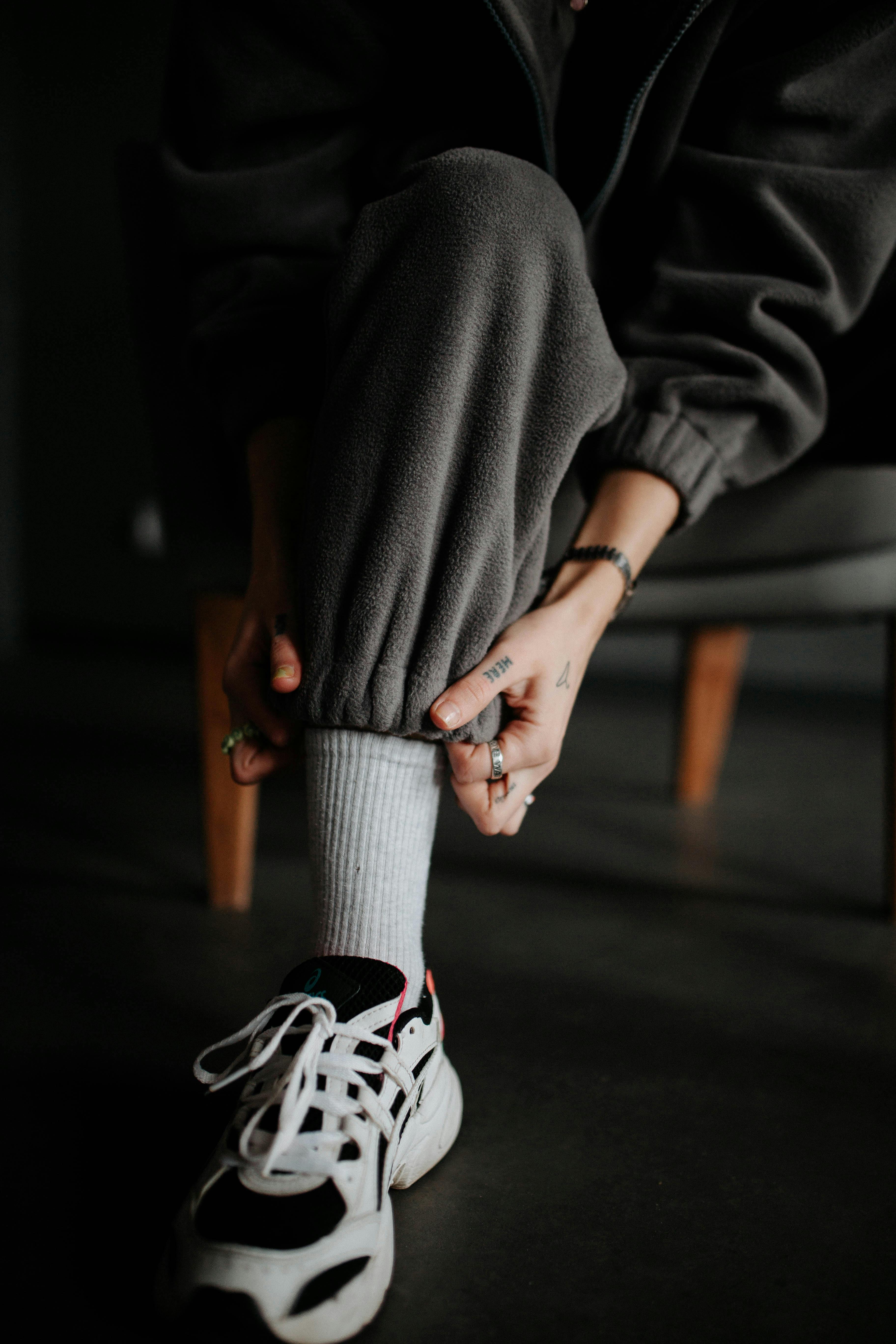 Woman Pulling up Sock · Free Stock Photo
