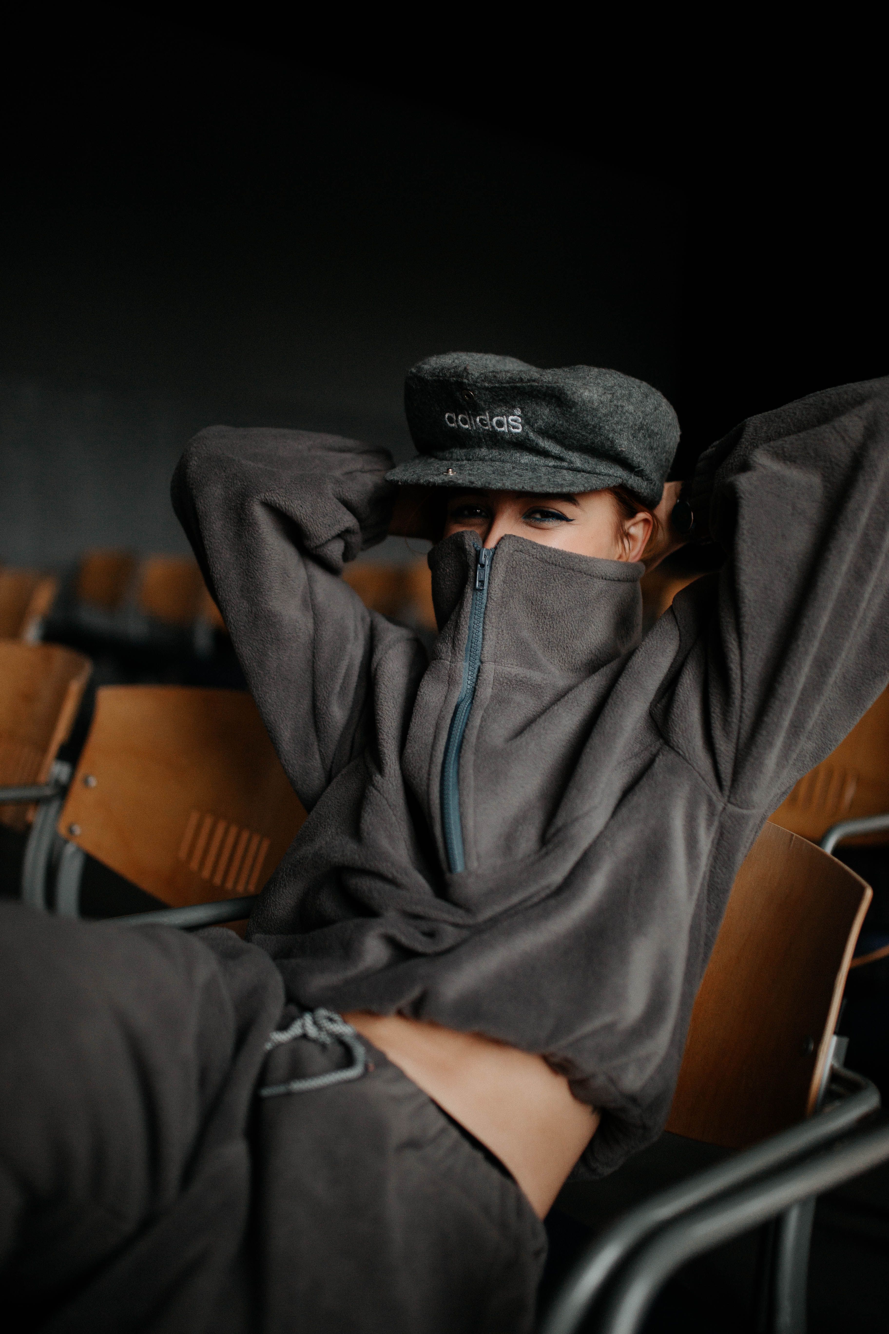 Woman in Sweatshirt Posing on Chair · Free Stock Photo