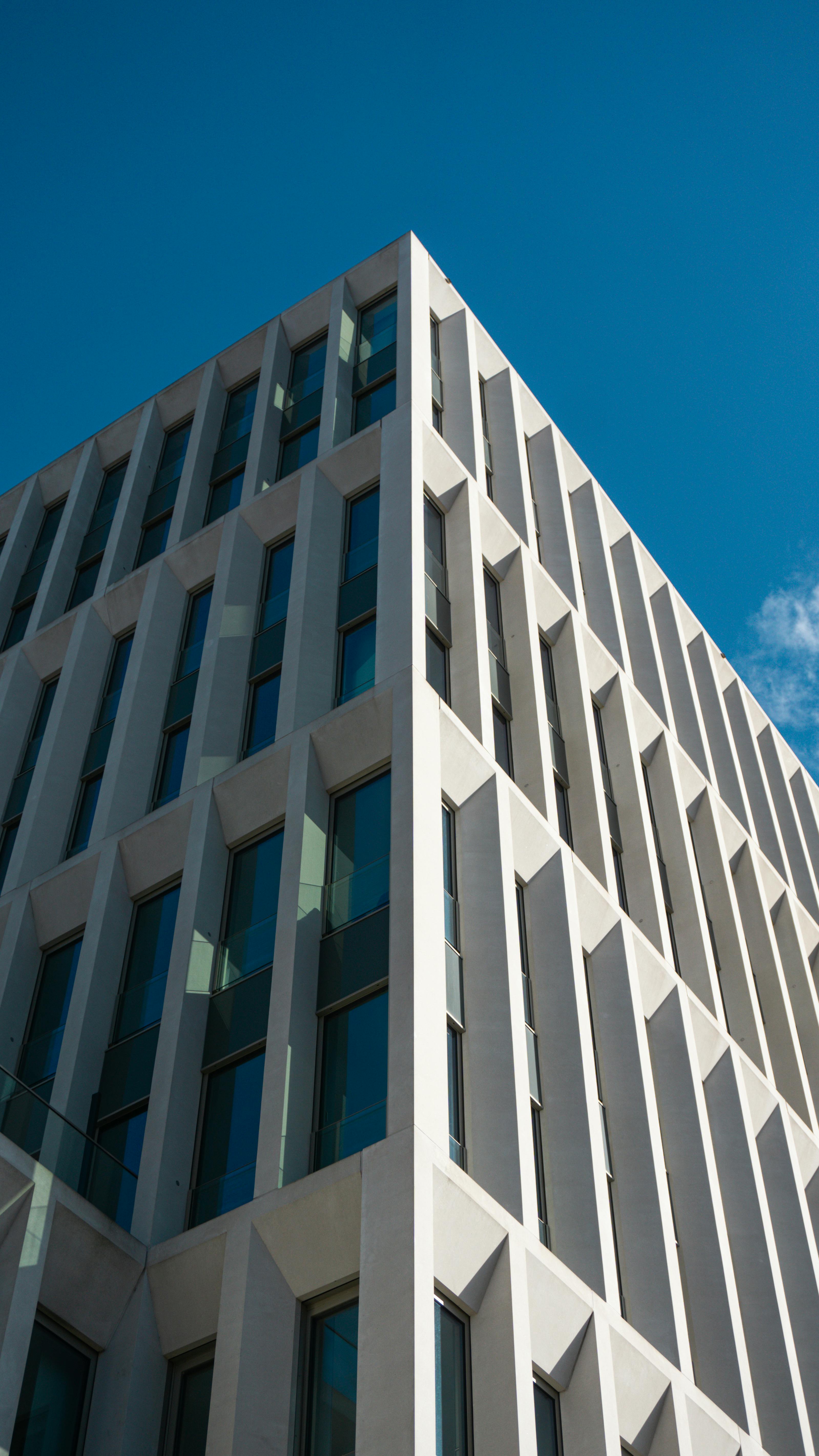 White Tall Building against Blue Sky · Free Stock Photo