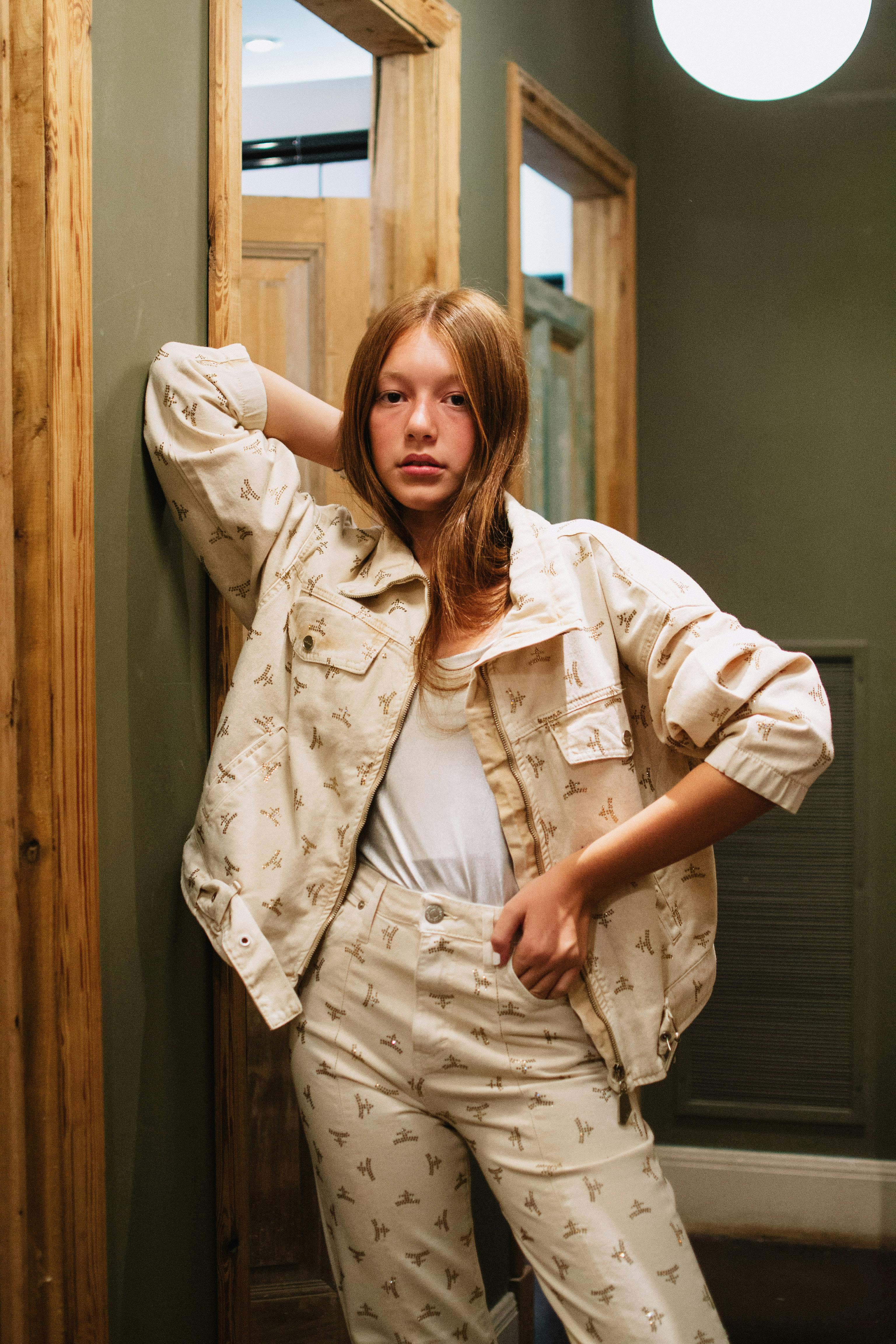 Girl Posing in a Fashionable Outfit · Free Stock Photo