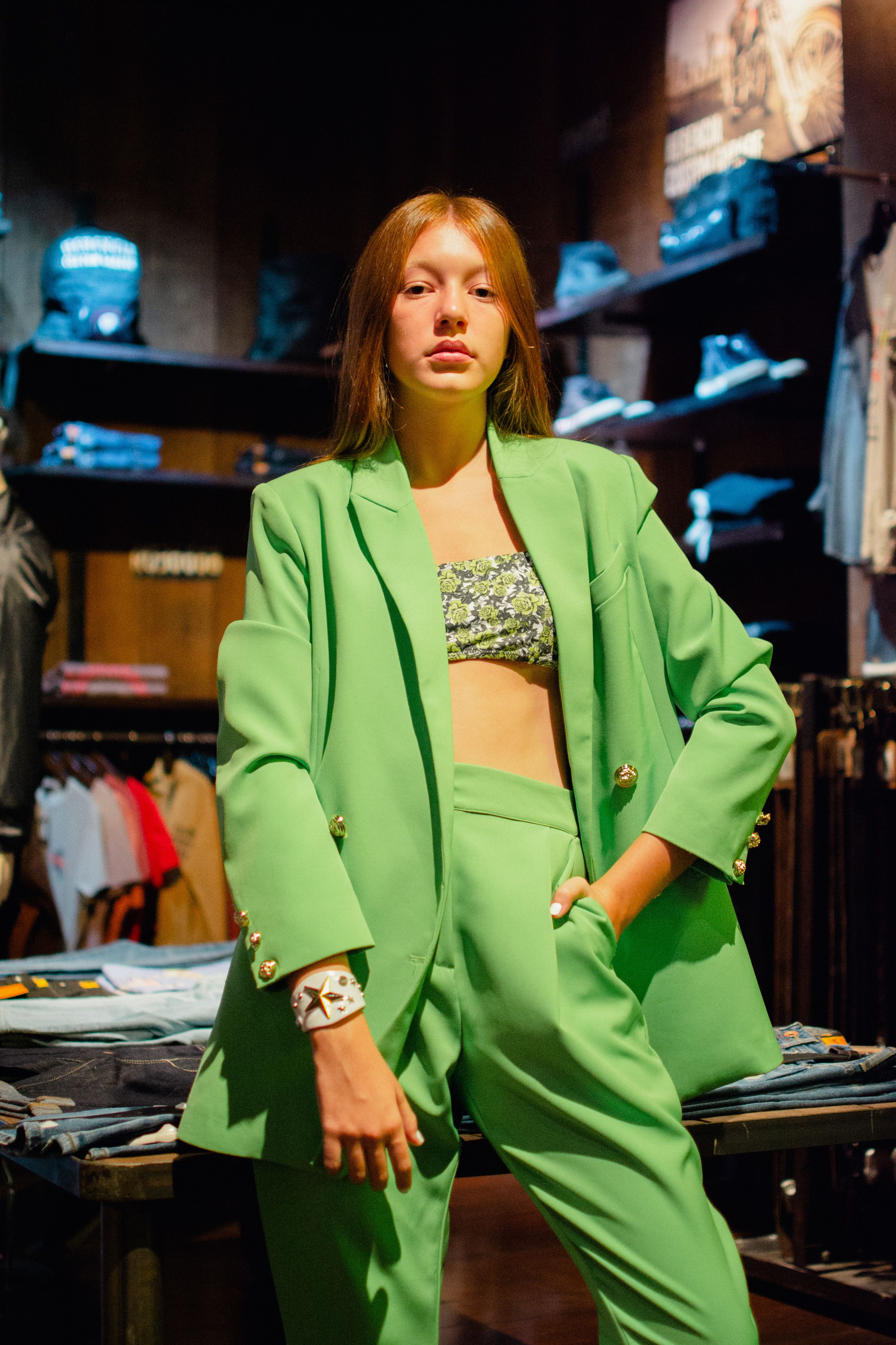 A Girl in a Trendy Outfit Posing in a Clothing Store · Free Stock Photo