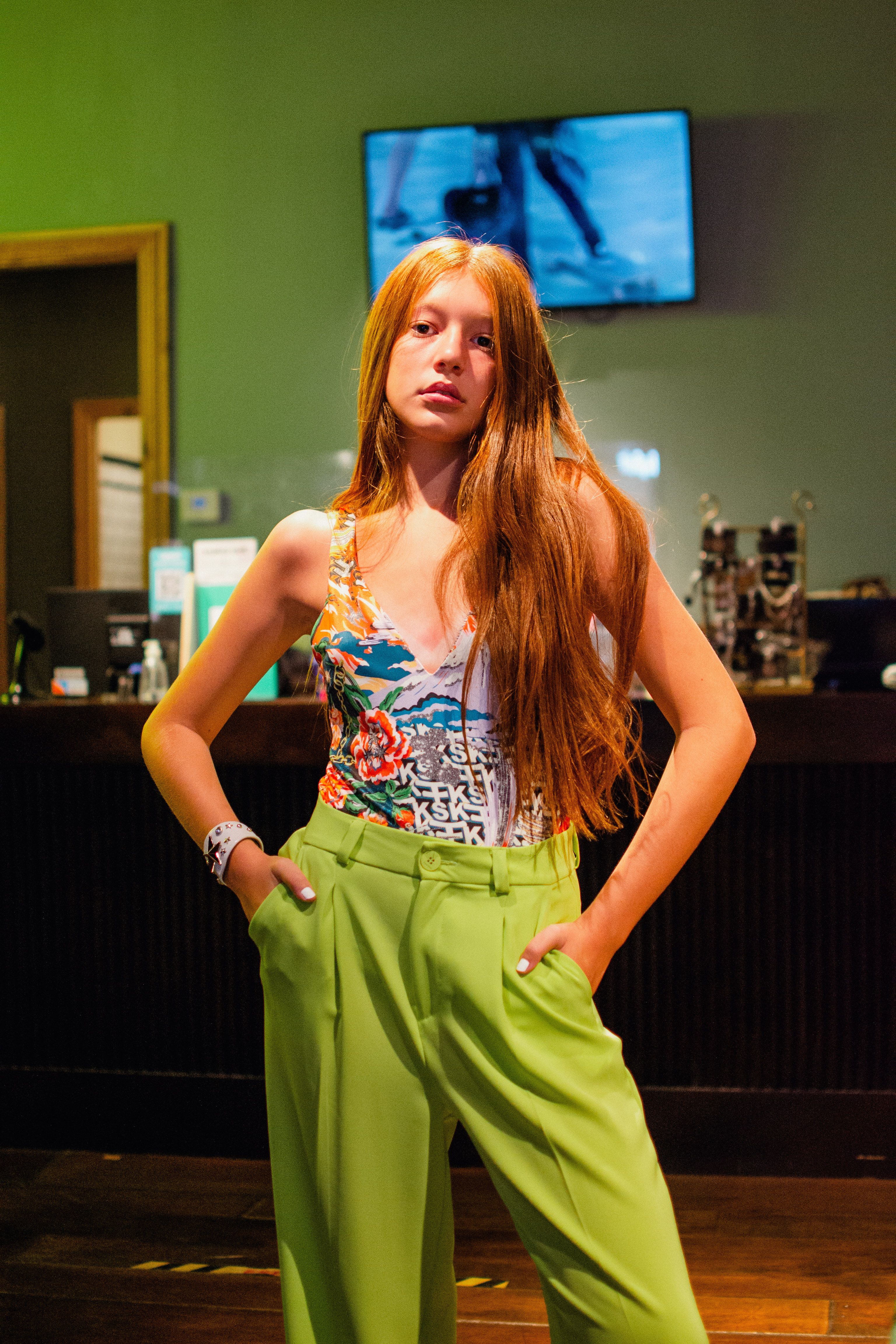 A Girl in a Trendy Outfit Posing in a Clothing Store · Free Stock Photo
