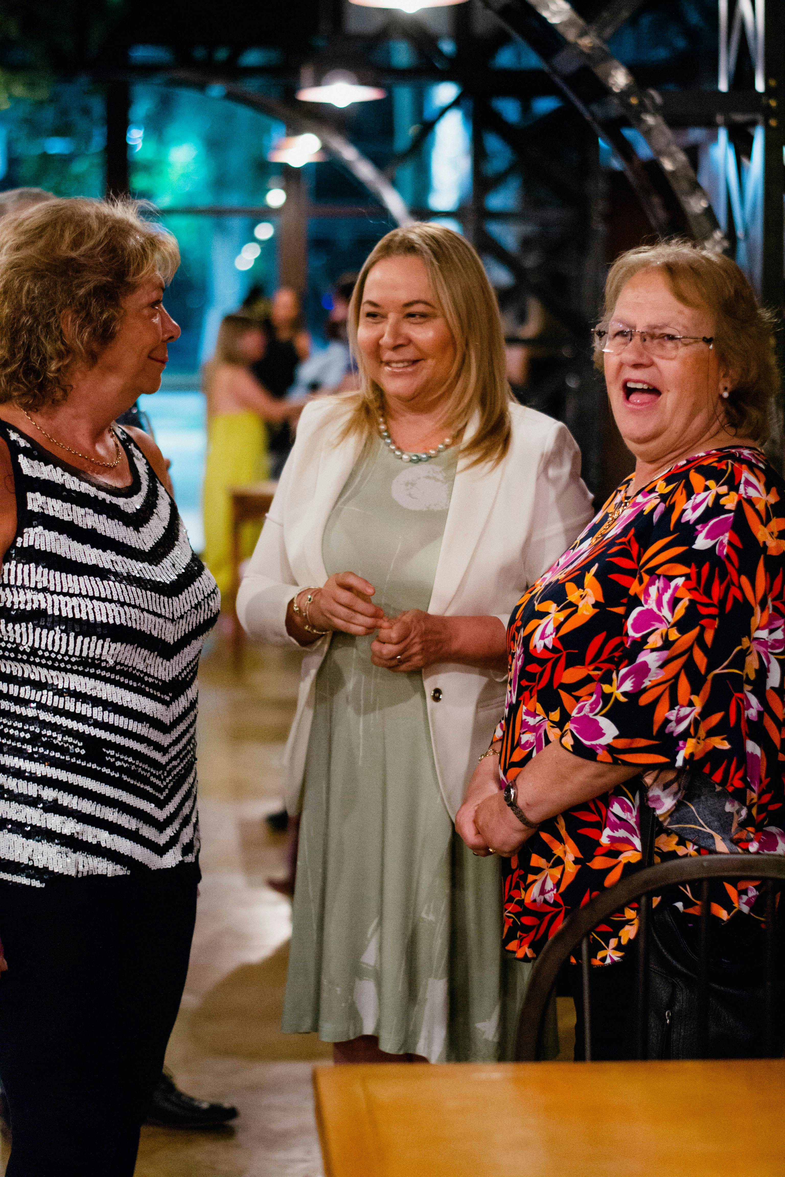 A Group of Women Talking and Smiling · Free Stock Photo