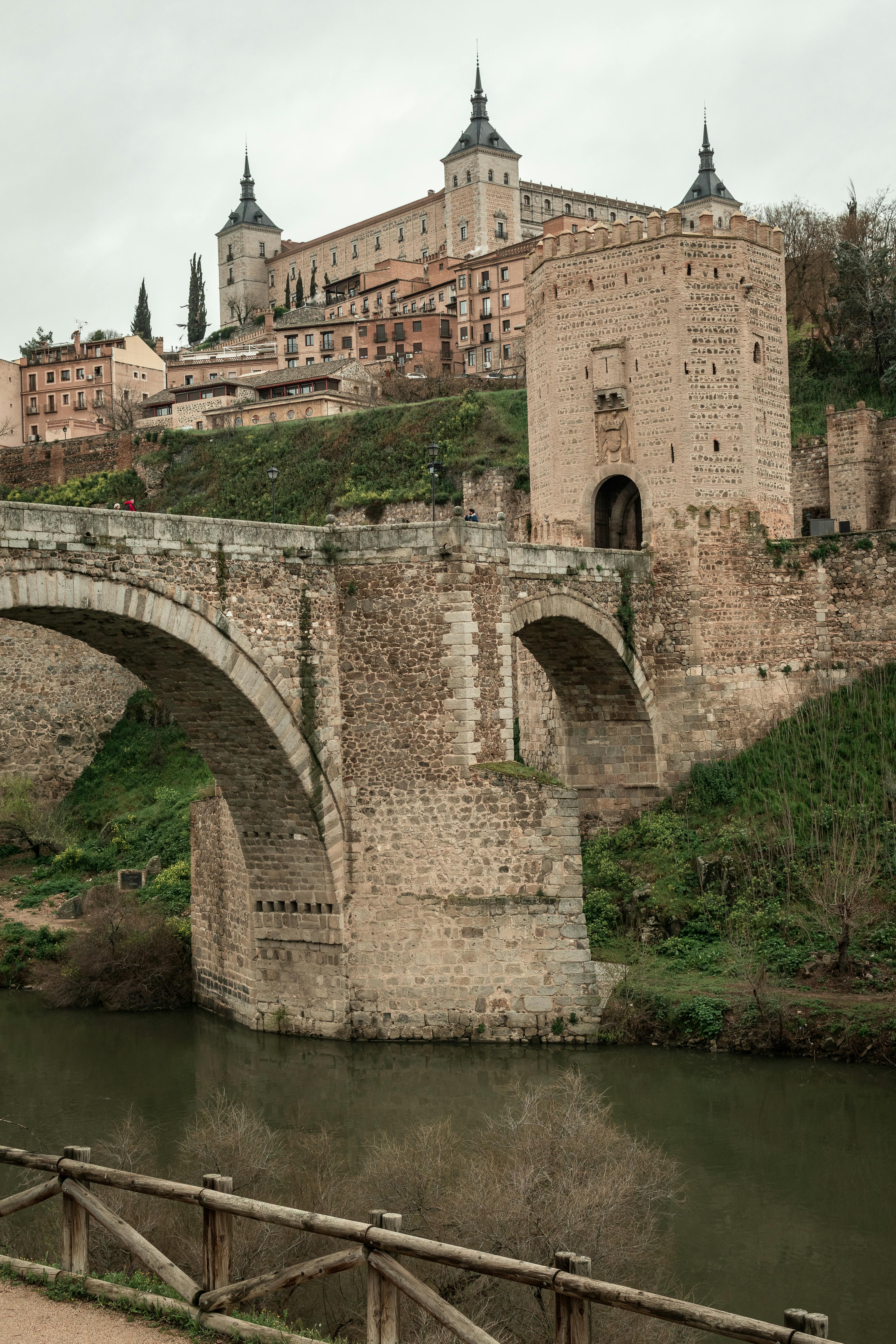 Roman Arch Bridge Puente de Alcantara and Alcazar of Toledo in Spain ...