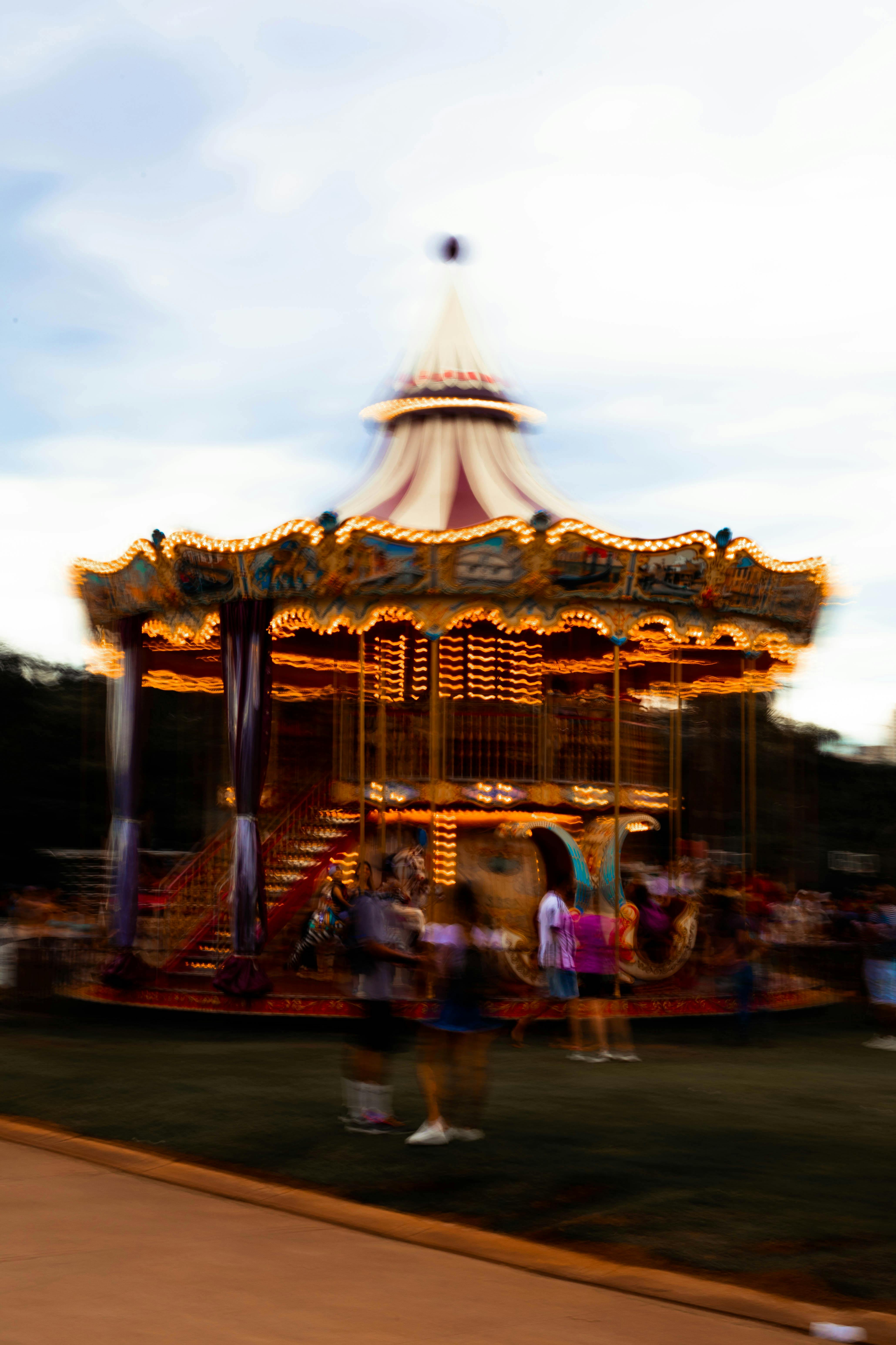 Girl Standing Near Carousel · Free Stock Photo