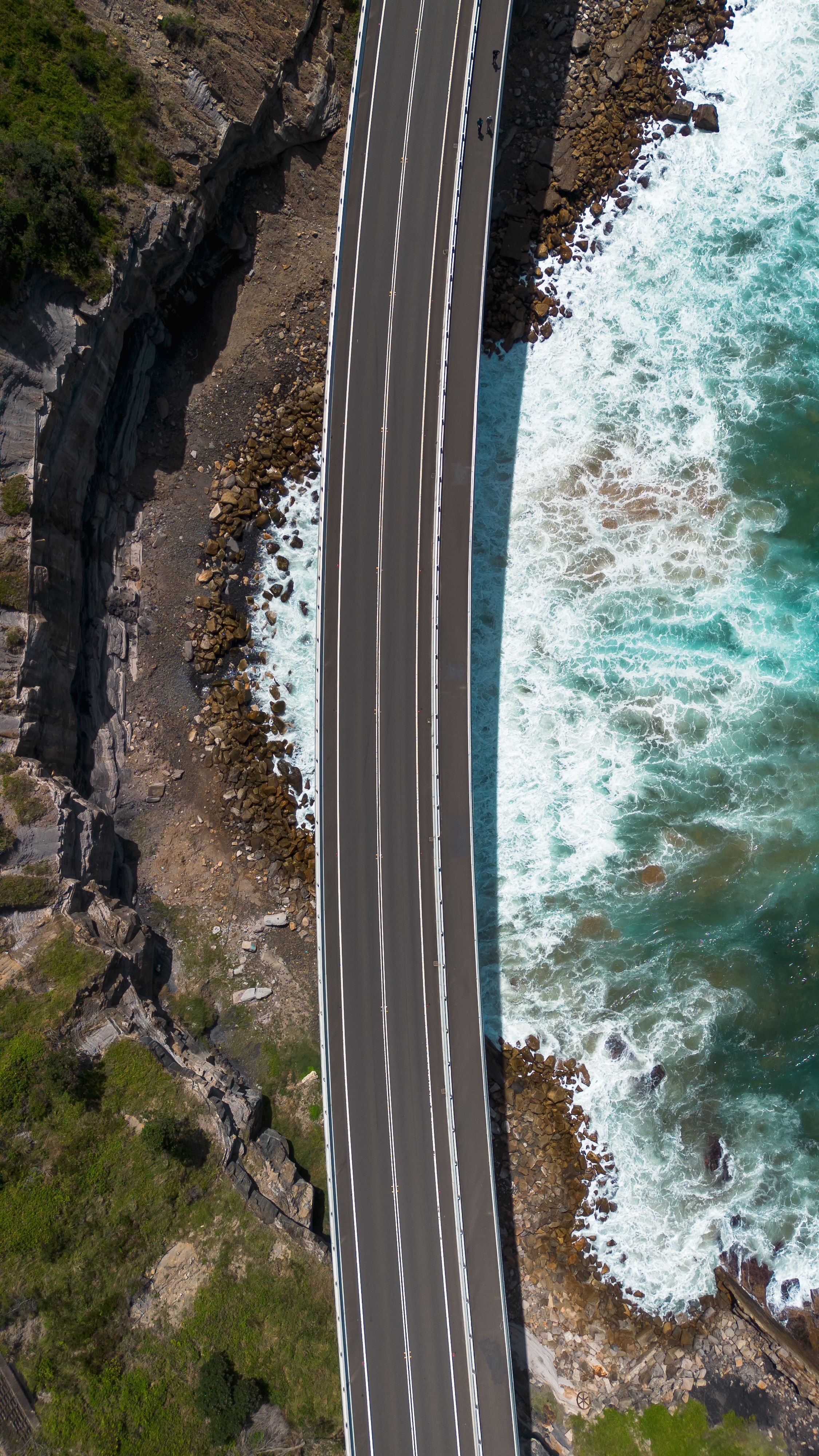 Two Vehicle on Pathway Beside Body of Water · Free Stock Photo