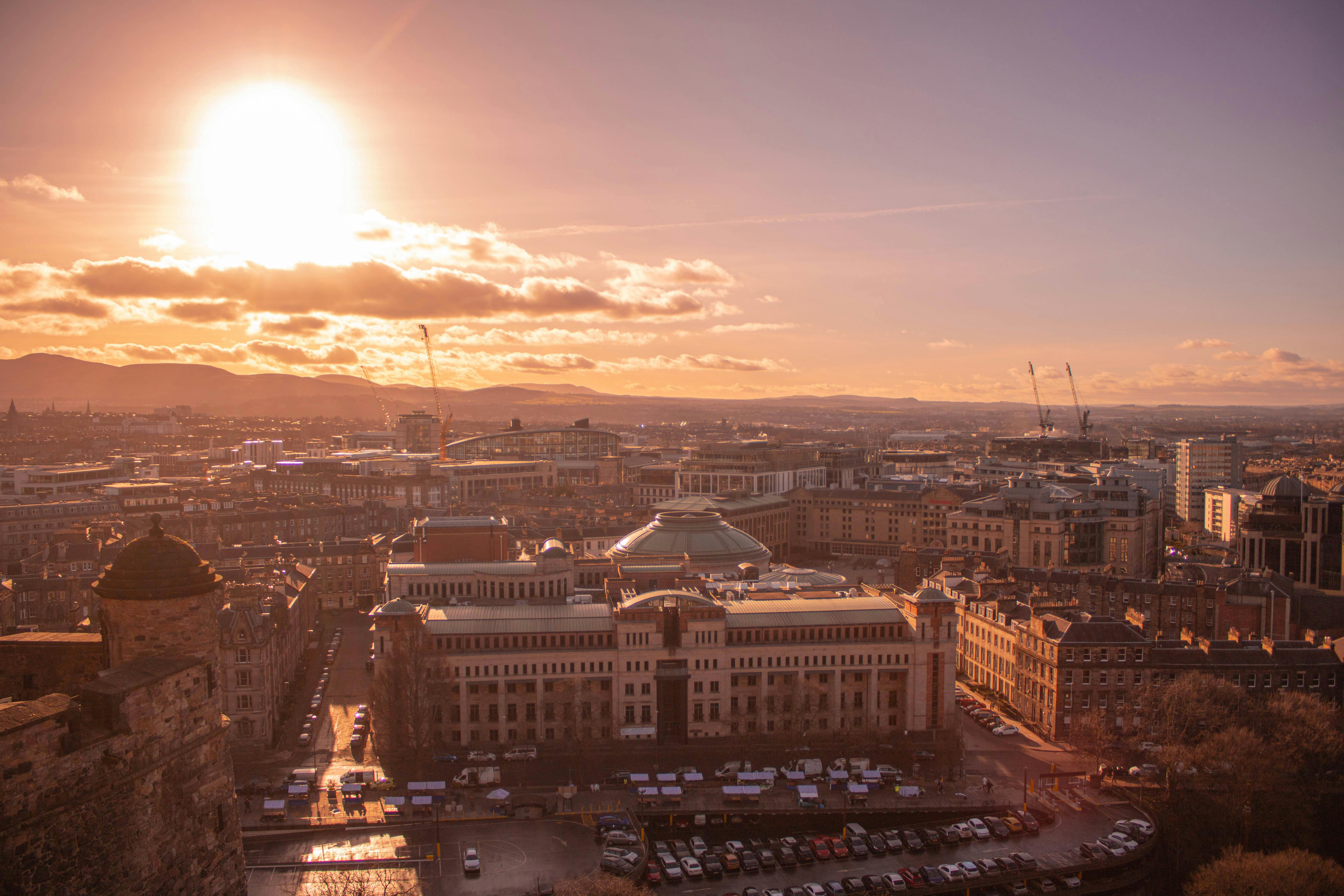 Sun over City at Sunset · Free Stock Photo
