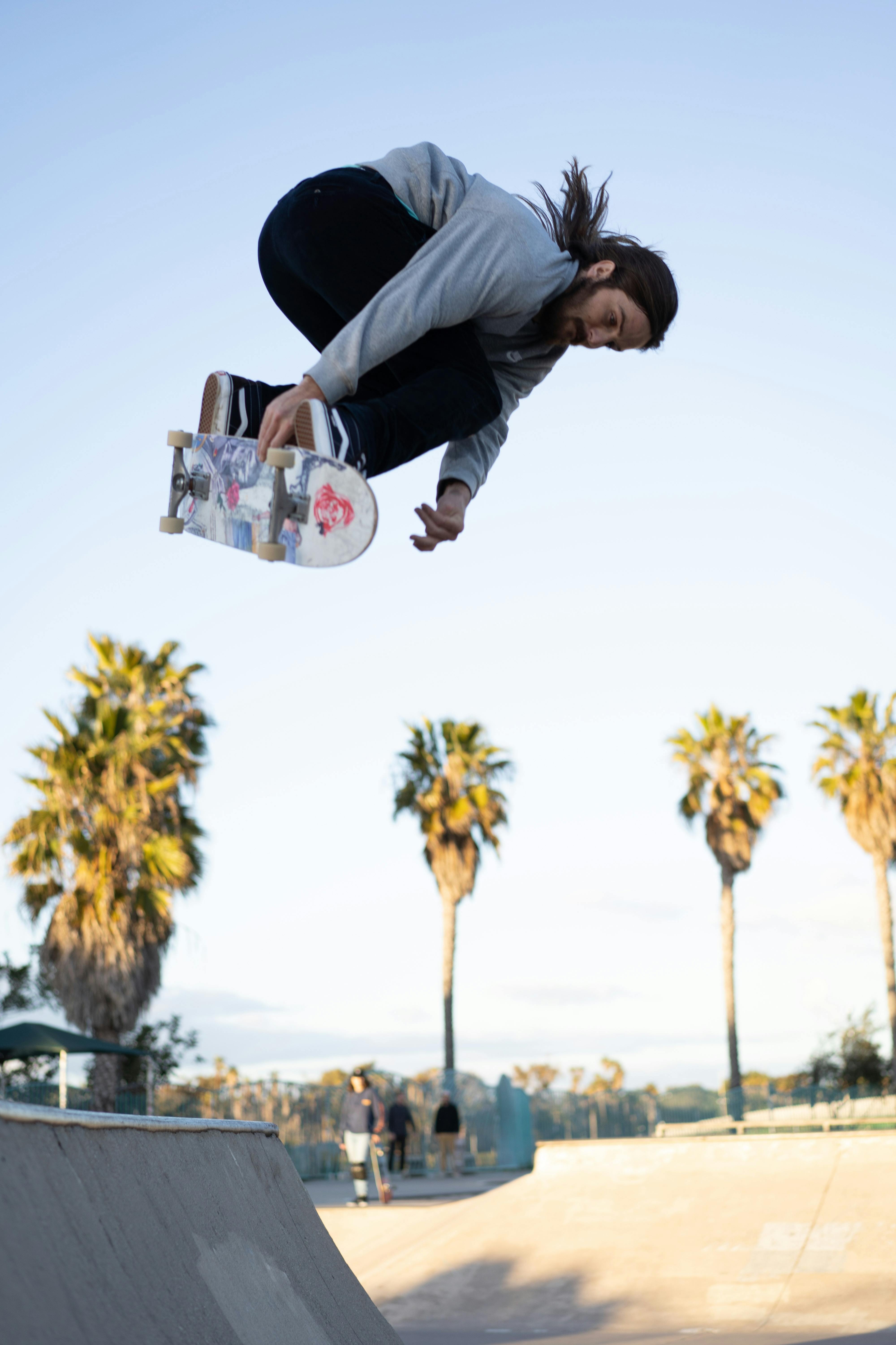 Man Jumping on Skateboard in Skating Park · Free Stock Photo