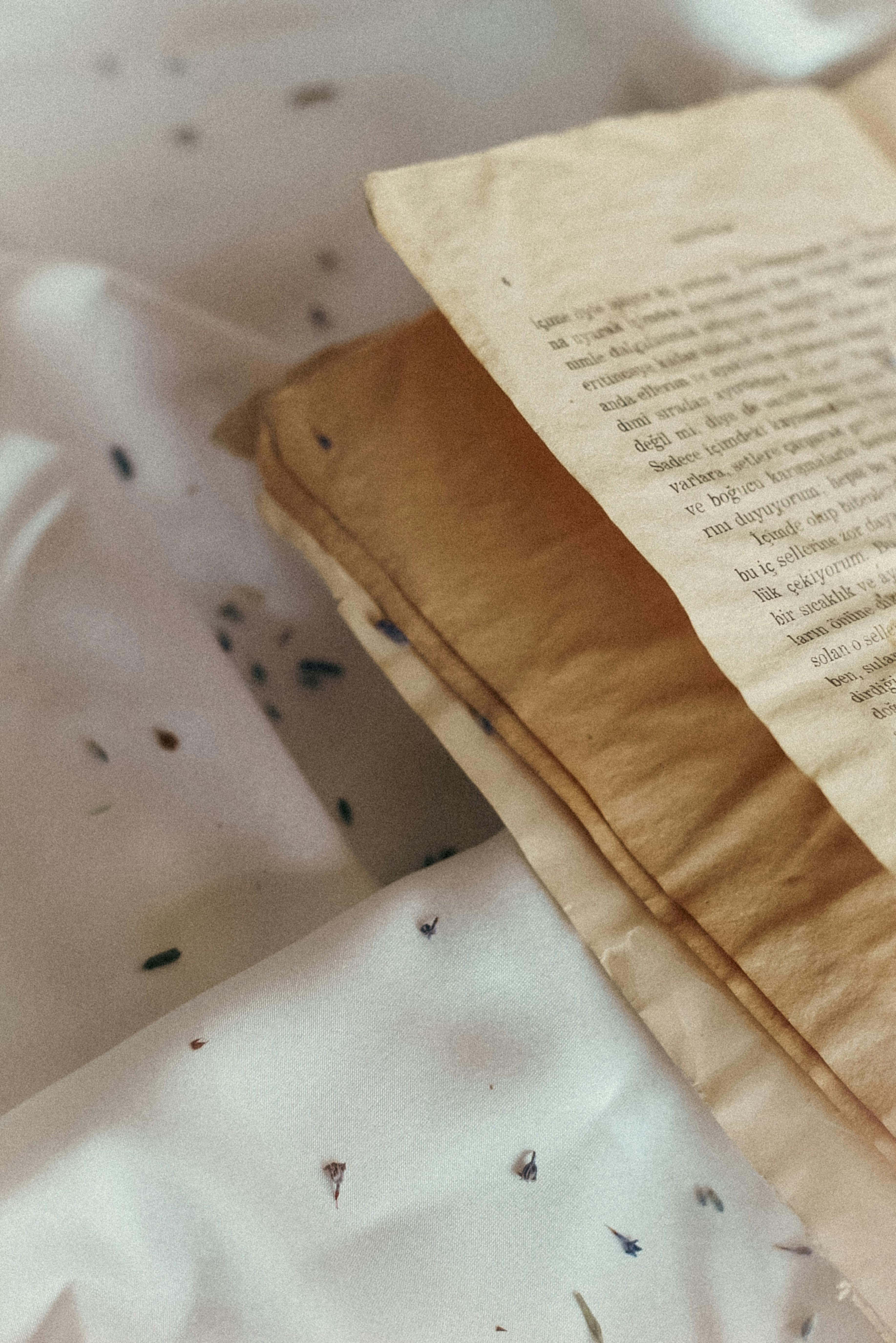 Woman in a Costume and a Crown with Old Yellow Book Pages Flying Around ...