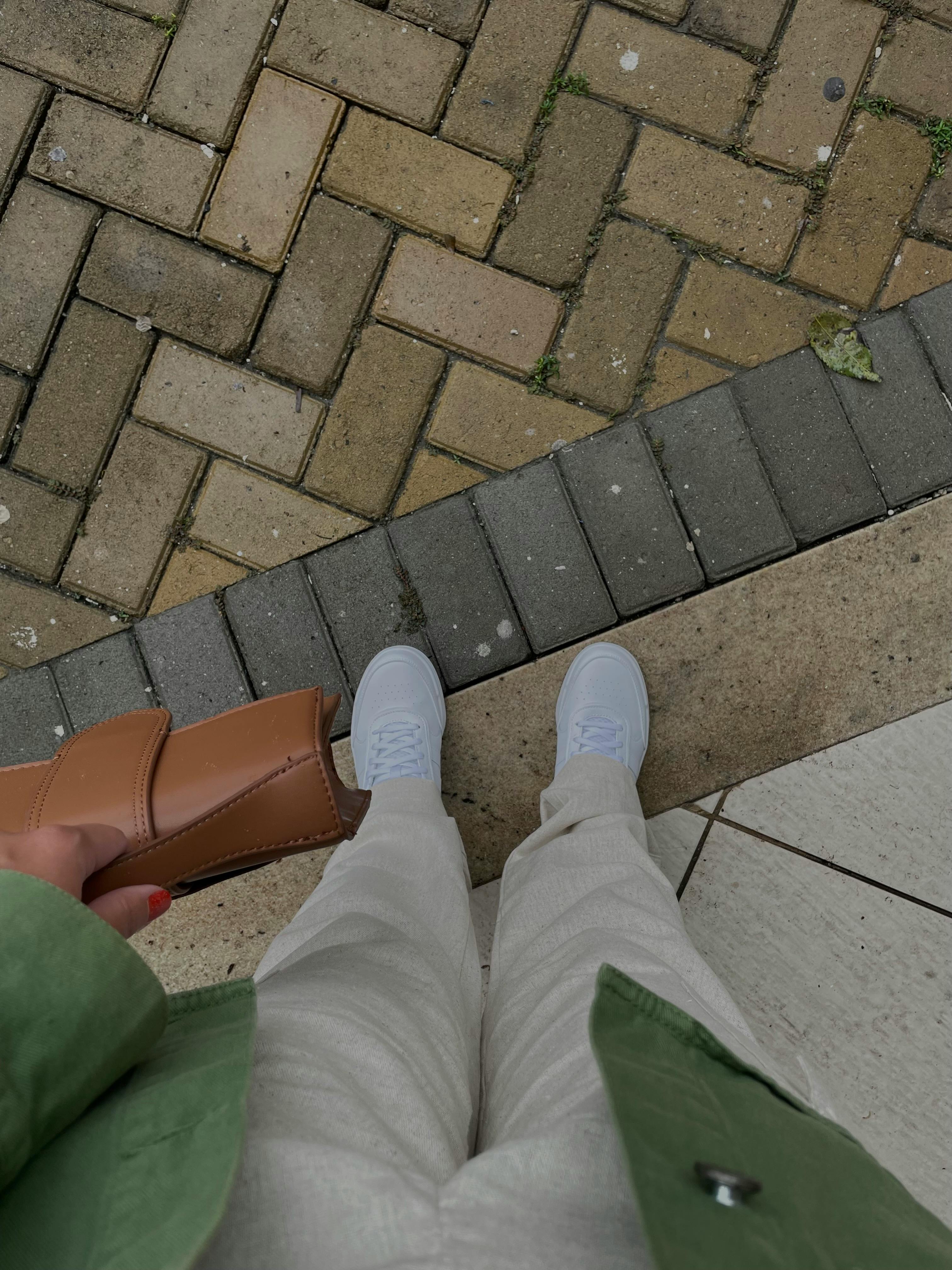 Woman Legs Standing on Pavement · Free Stock Photo