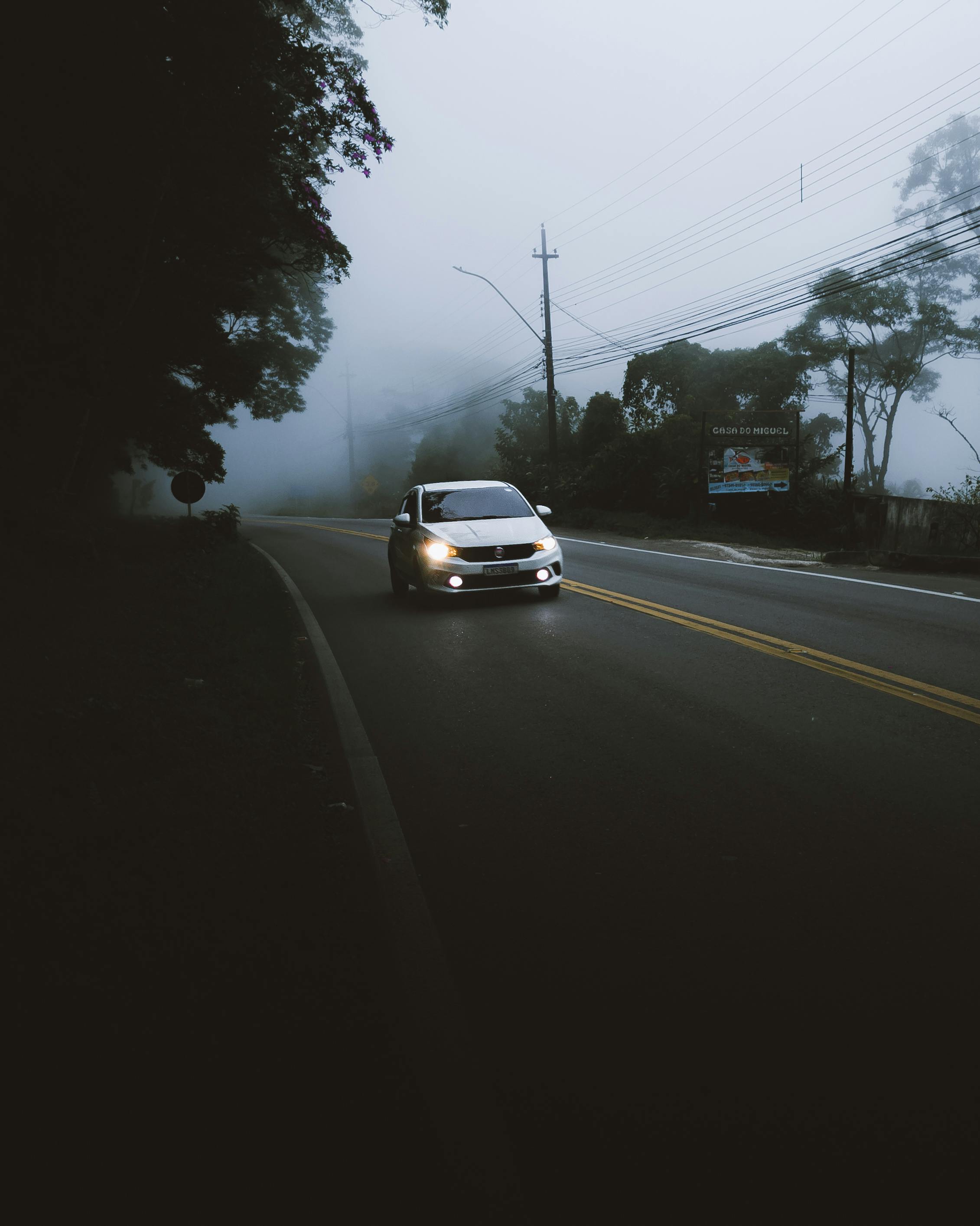 Car Driving Down the Road · Free Stock Photo