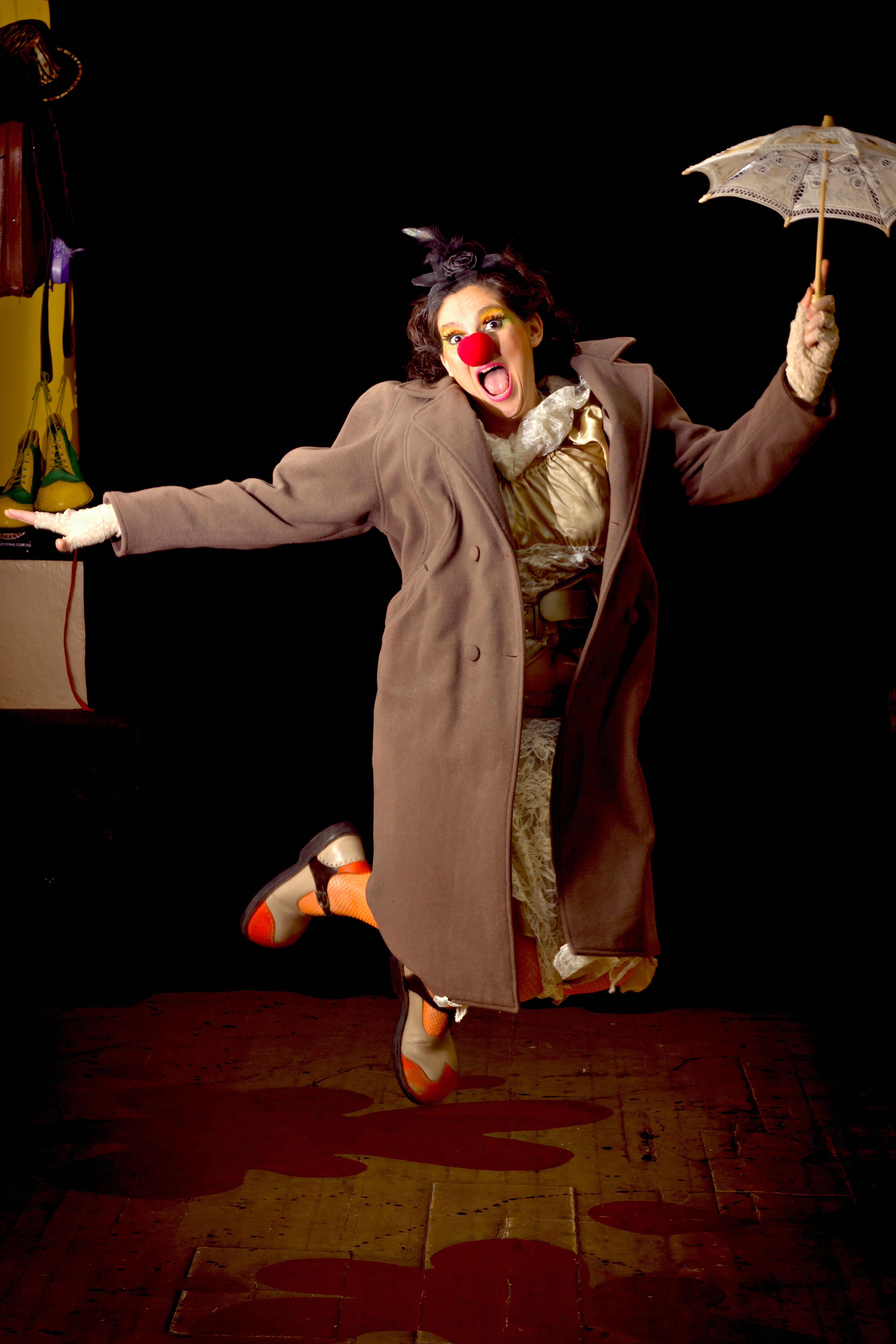 Clown in Coat Jumping over Stage · Free Stock Photo