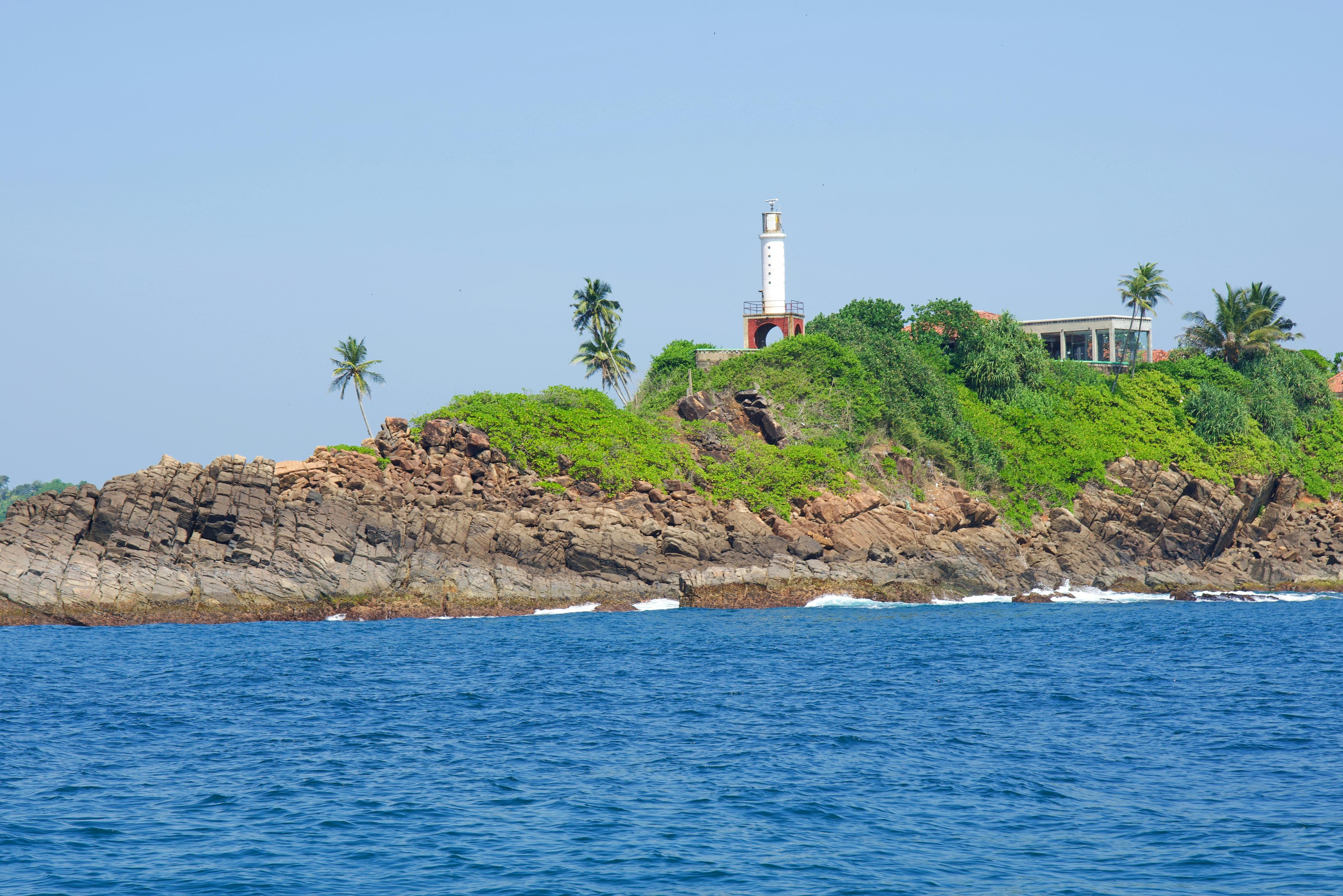 Rock and Mud on Sea Shore with Lighthouse behind at Sunset · Free Stock ...