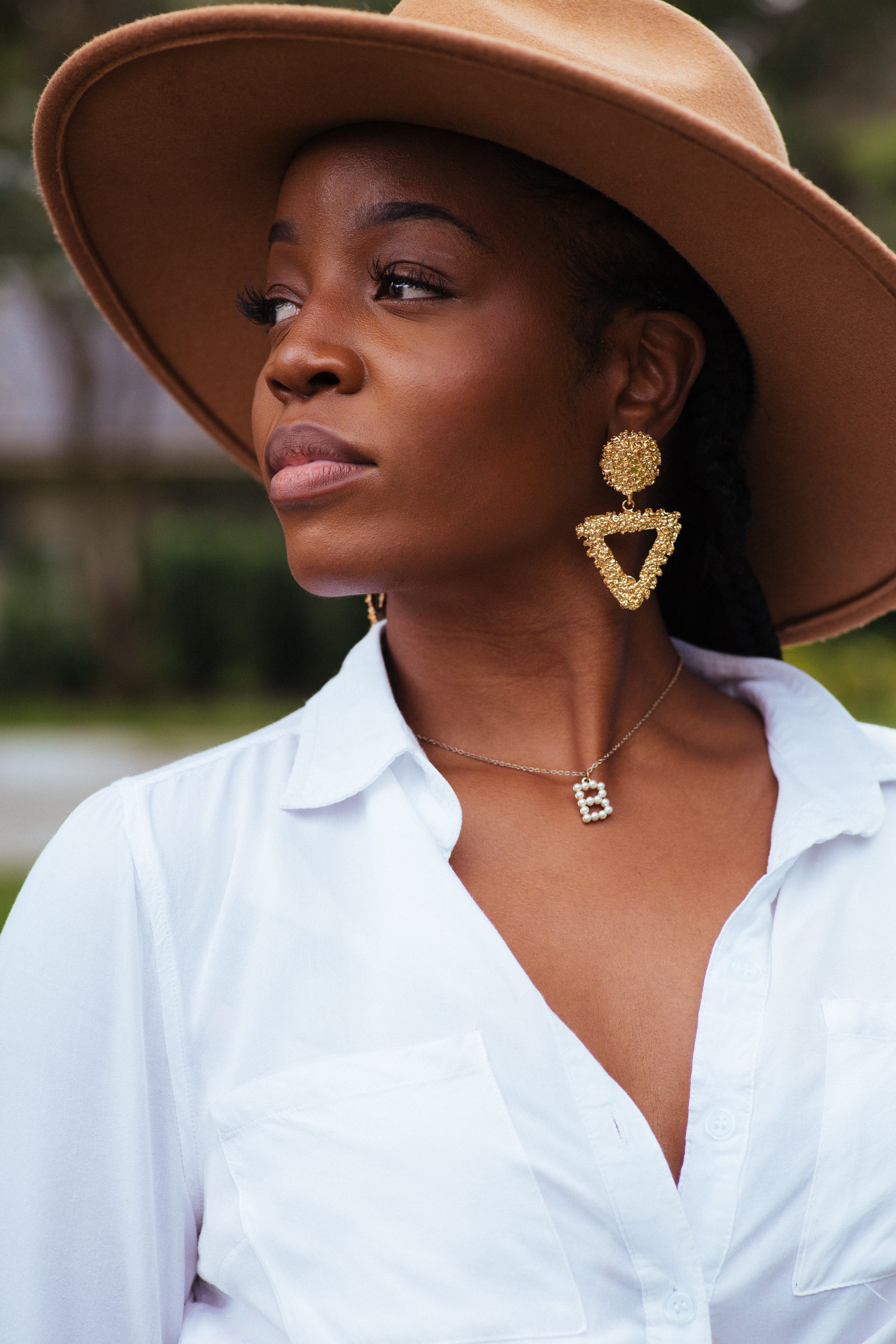 Woman Posing in White Hat · Free Stock Photo
