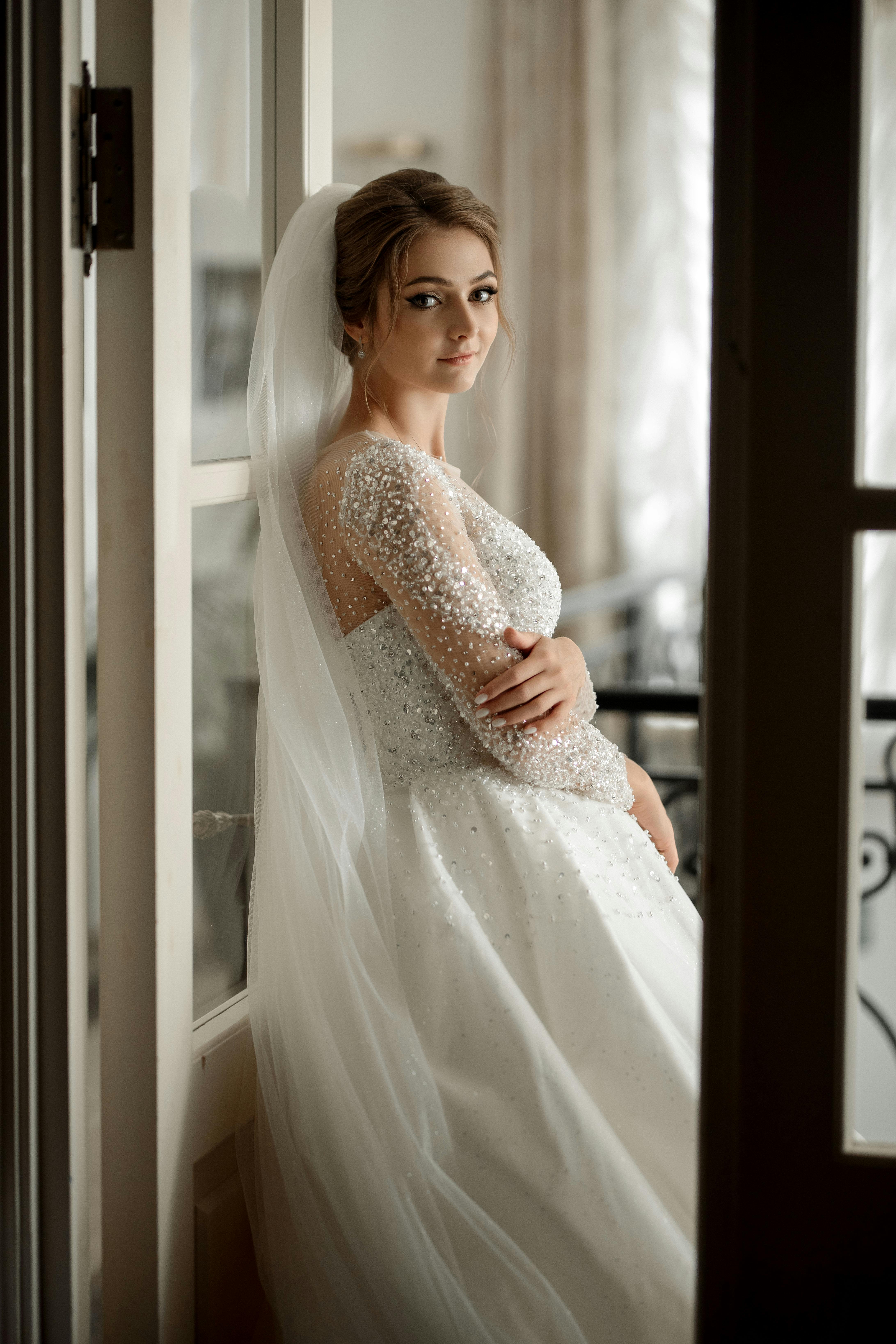 Portrait of a Bride Leaning on a Door · Free Stock Photo
