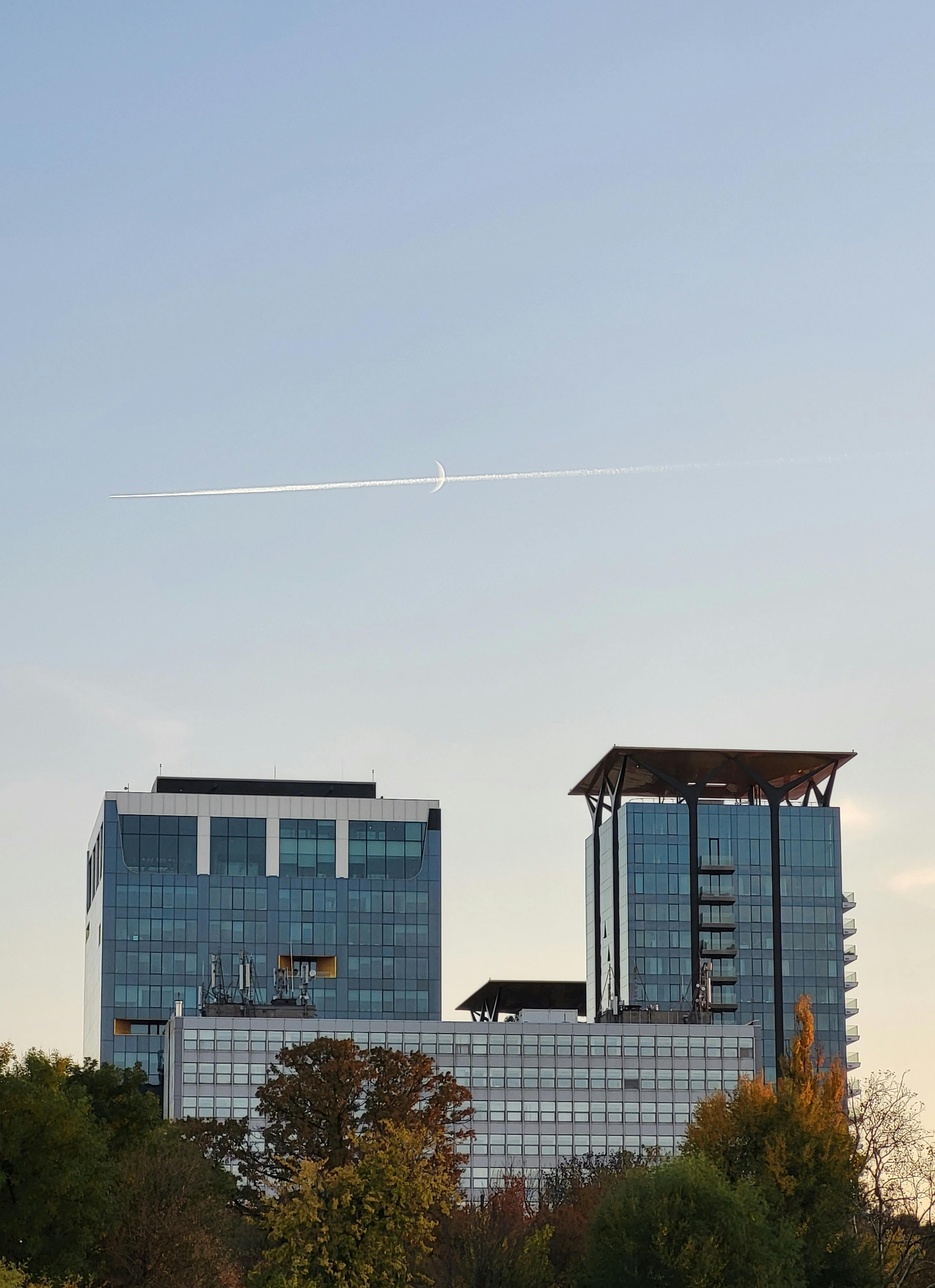 Modern Glass Skyscraper with Lights on Dark Sky Background · Free Stock ...