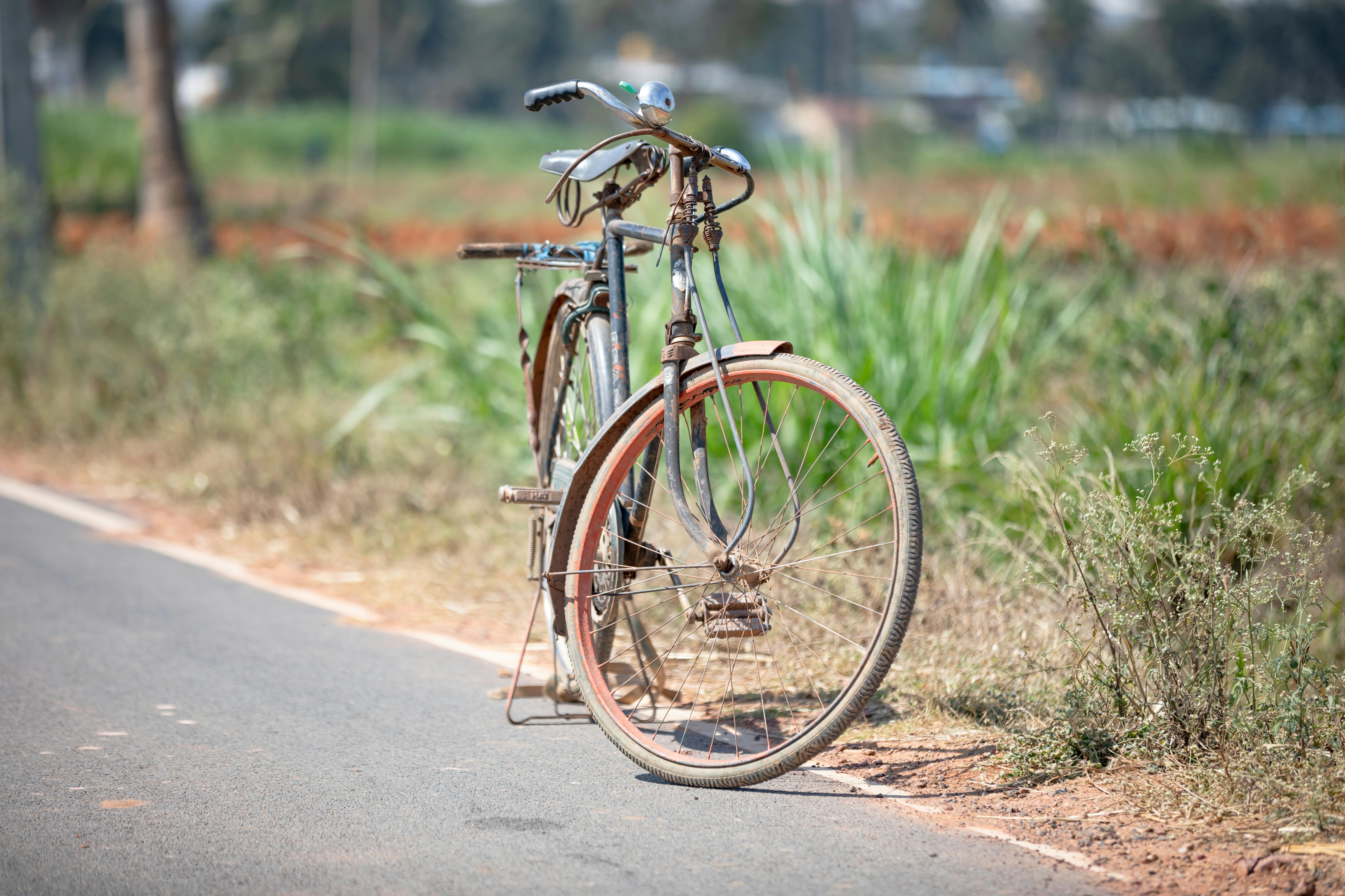 Old Rusting Bicycle Placed on the Road · Free Stock Photo