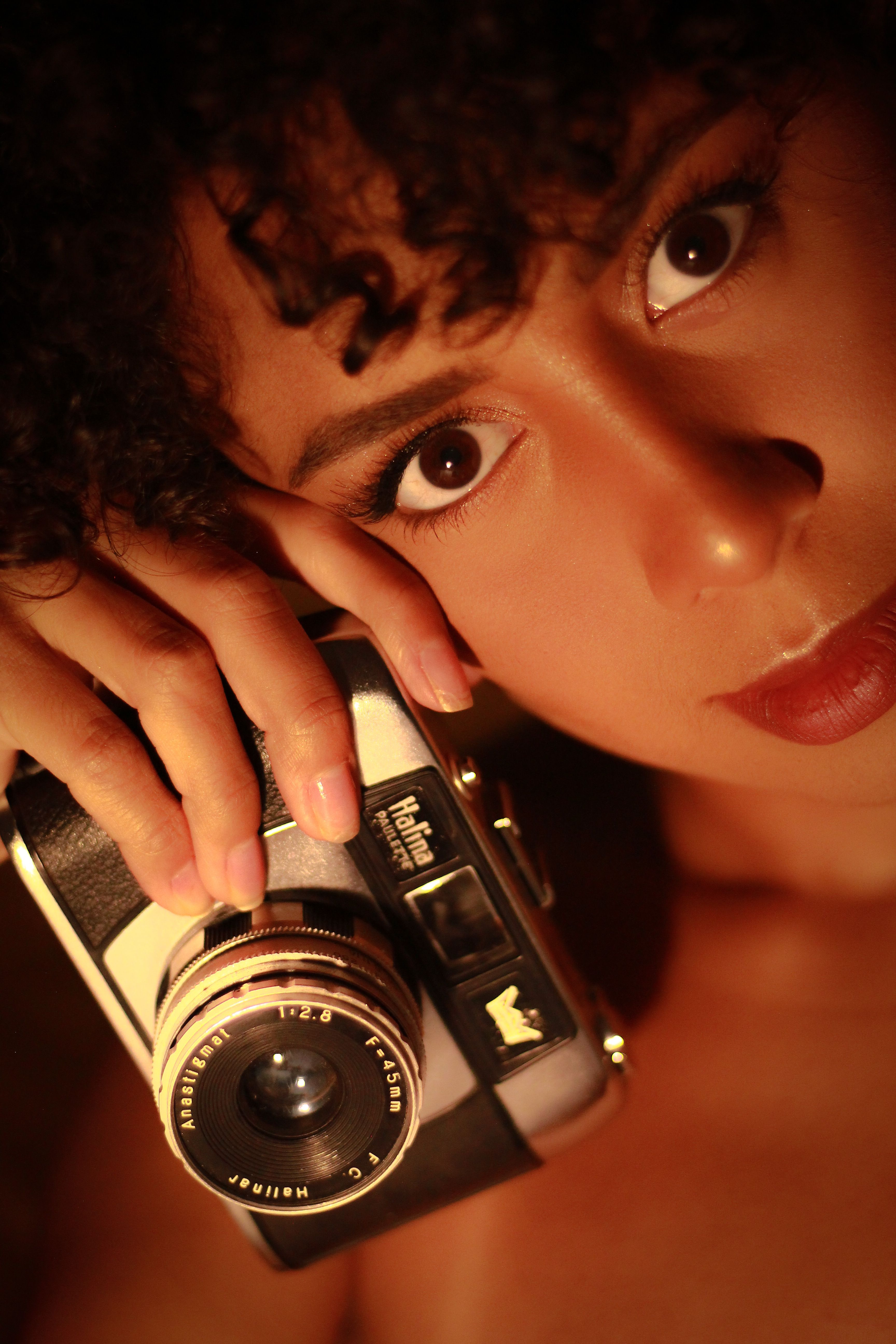 Woman Posing with Camera · Free Stock Photo