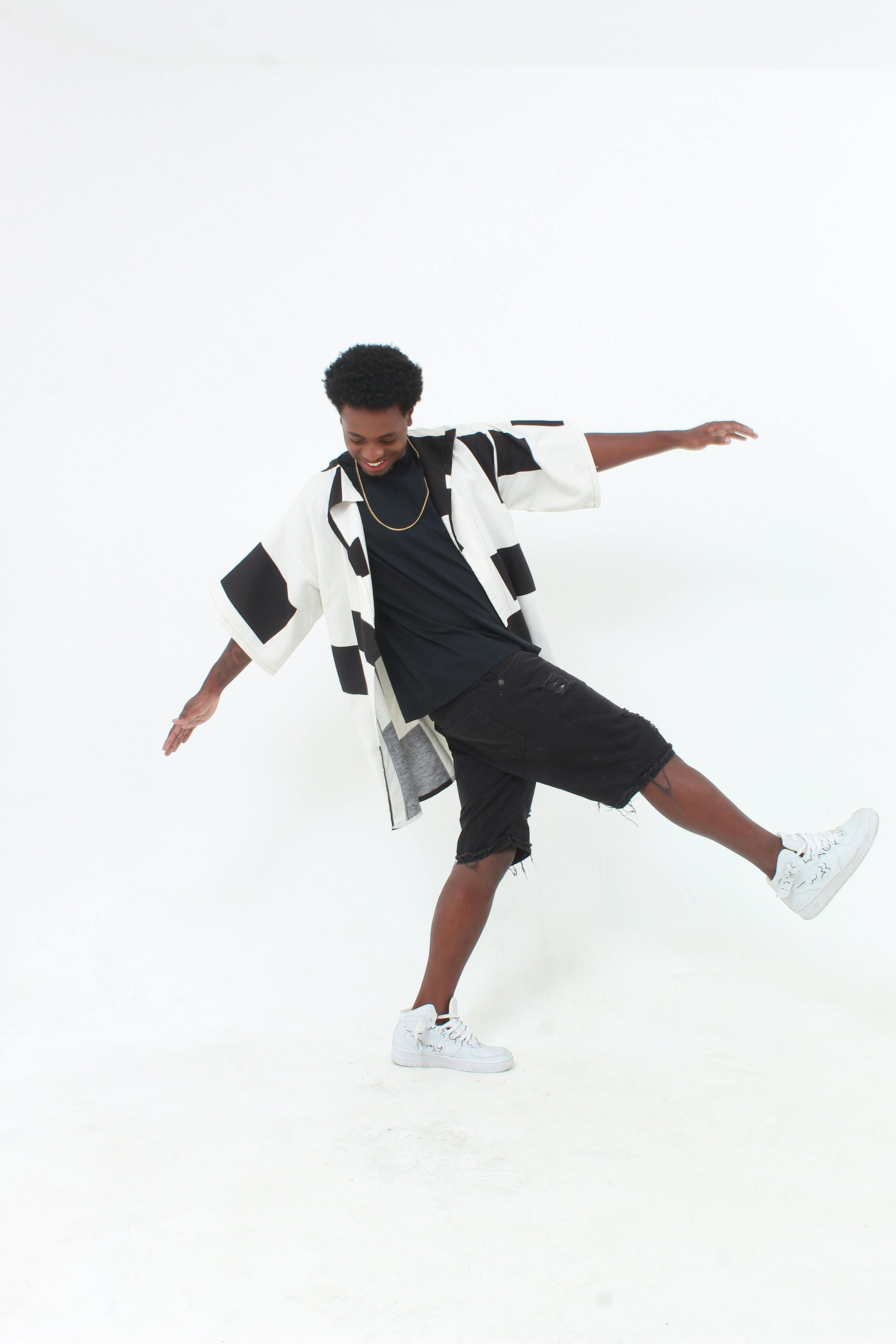 Young Man Standing Still in a Studio · Free Stock Photo