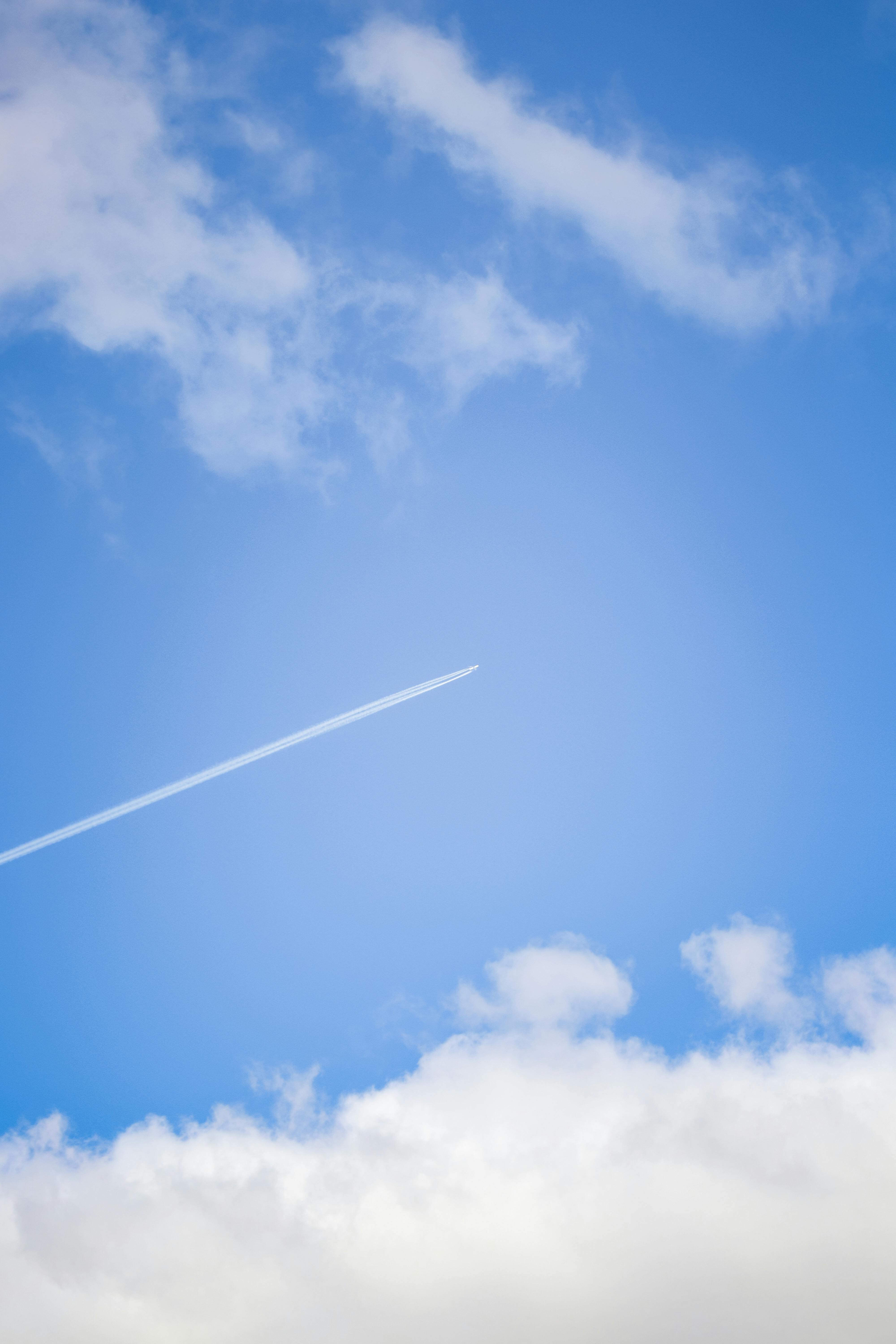 Airplane Forming Contrail in Sky · Free Stock Photo