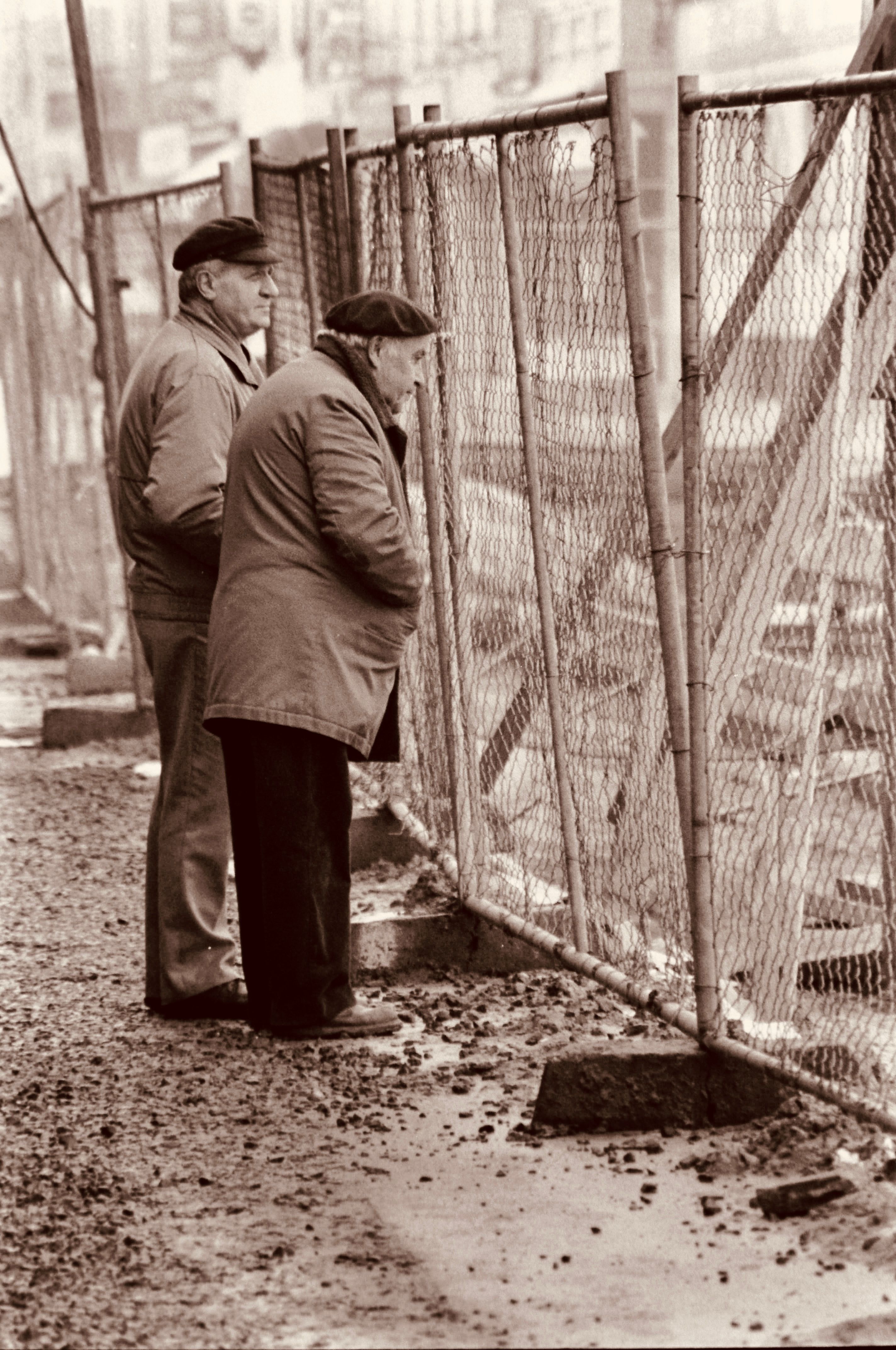 Men by Fence · Free Stock Photo
