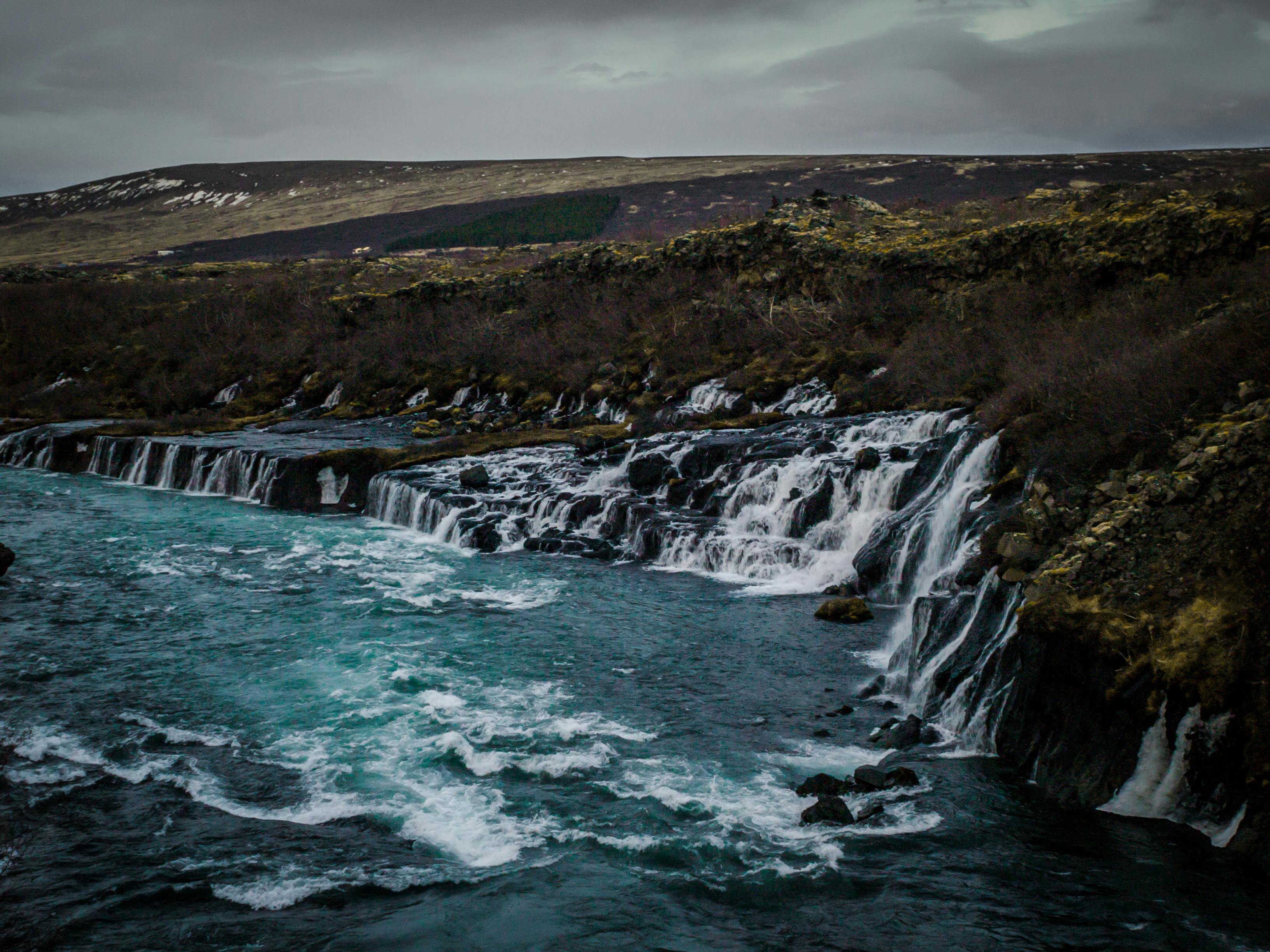 Aerial View of Waterfall Leading to Sea · Free Stock Photo
