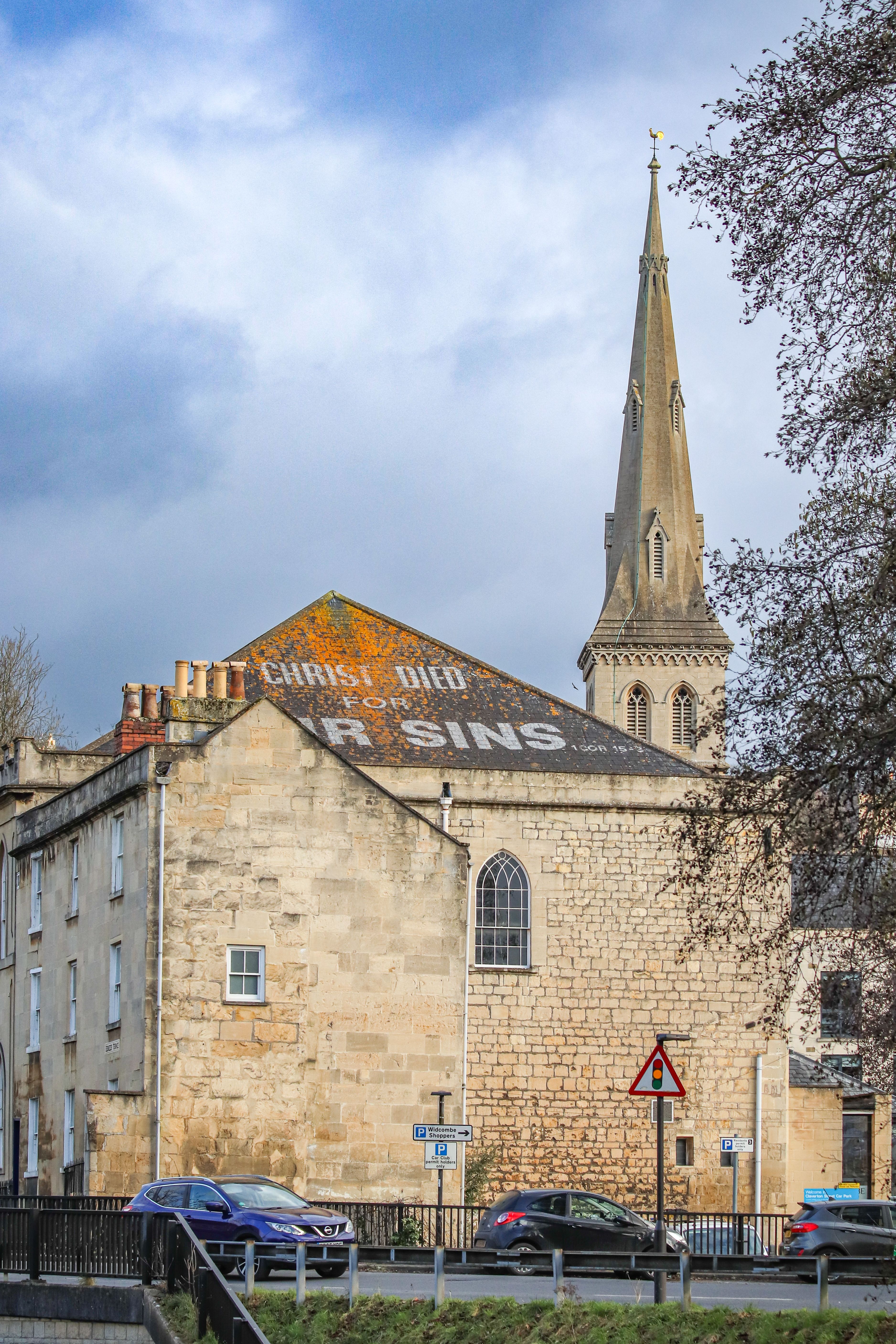 Building and Church Tower · Free Stock Photo