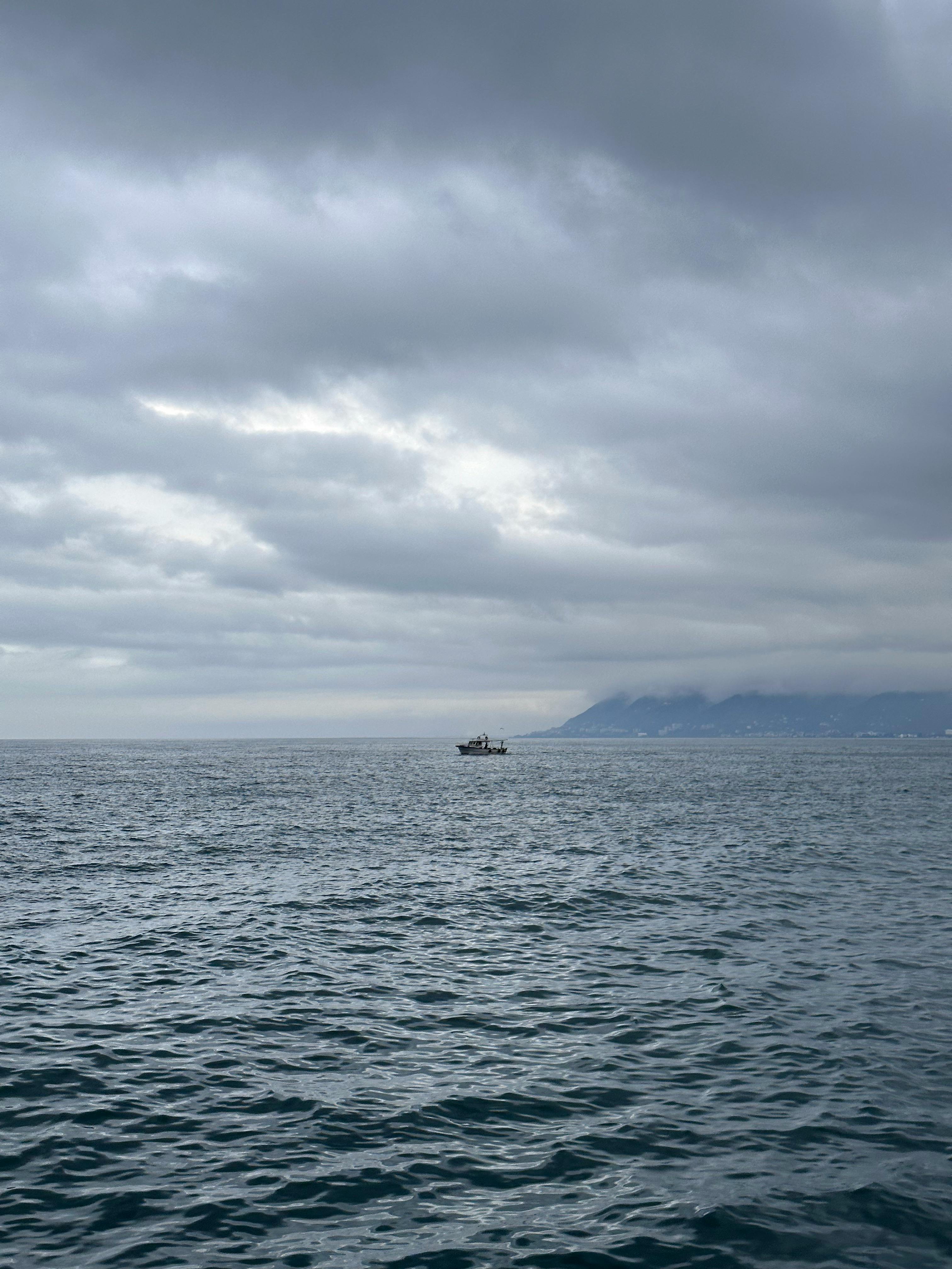 A Beach Covered in Snow and the Seascape under a Cloudy Sky · Free ...