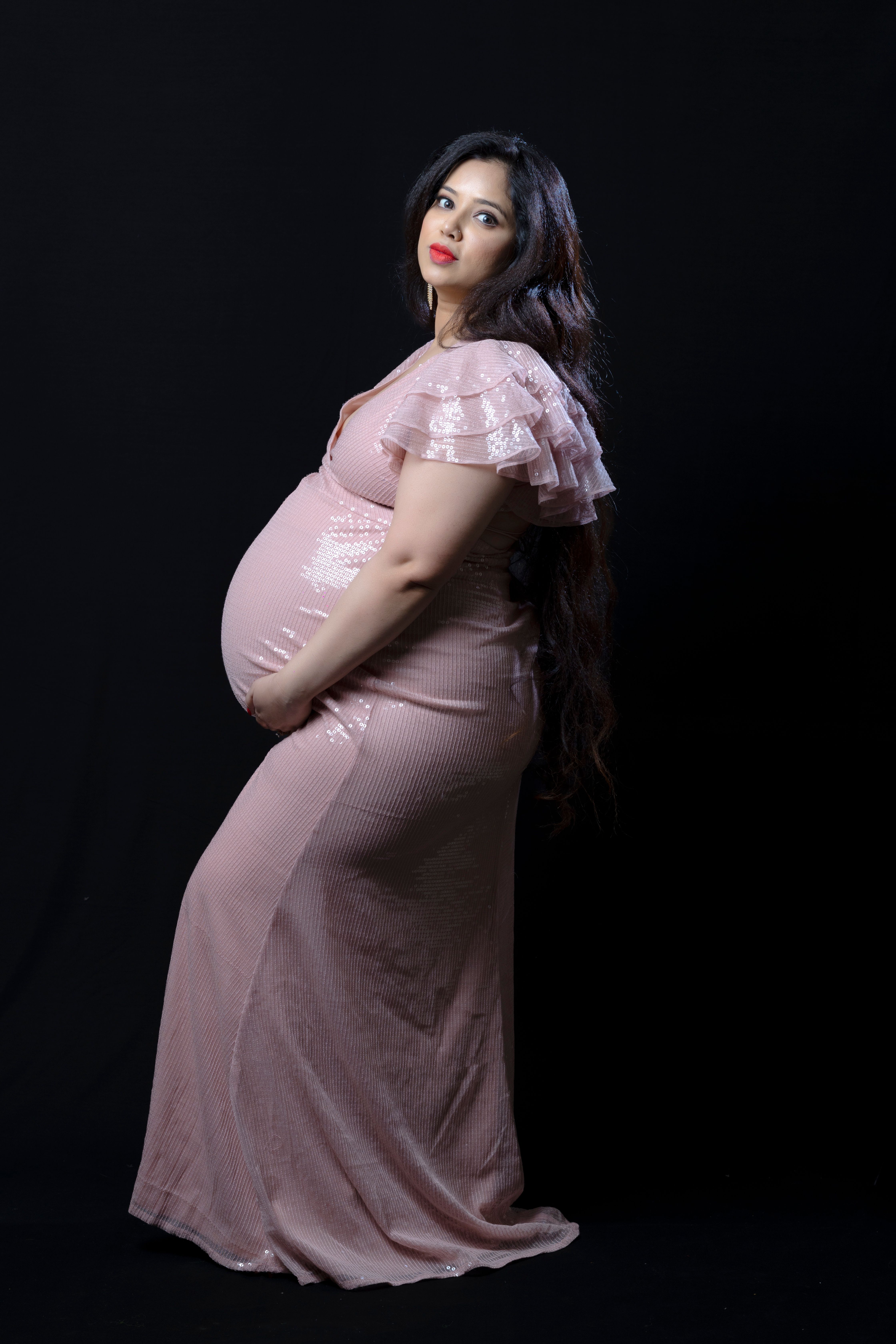 Standing Pregnant Woman Posing in Studio · Free Stock Photo