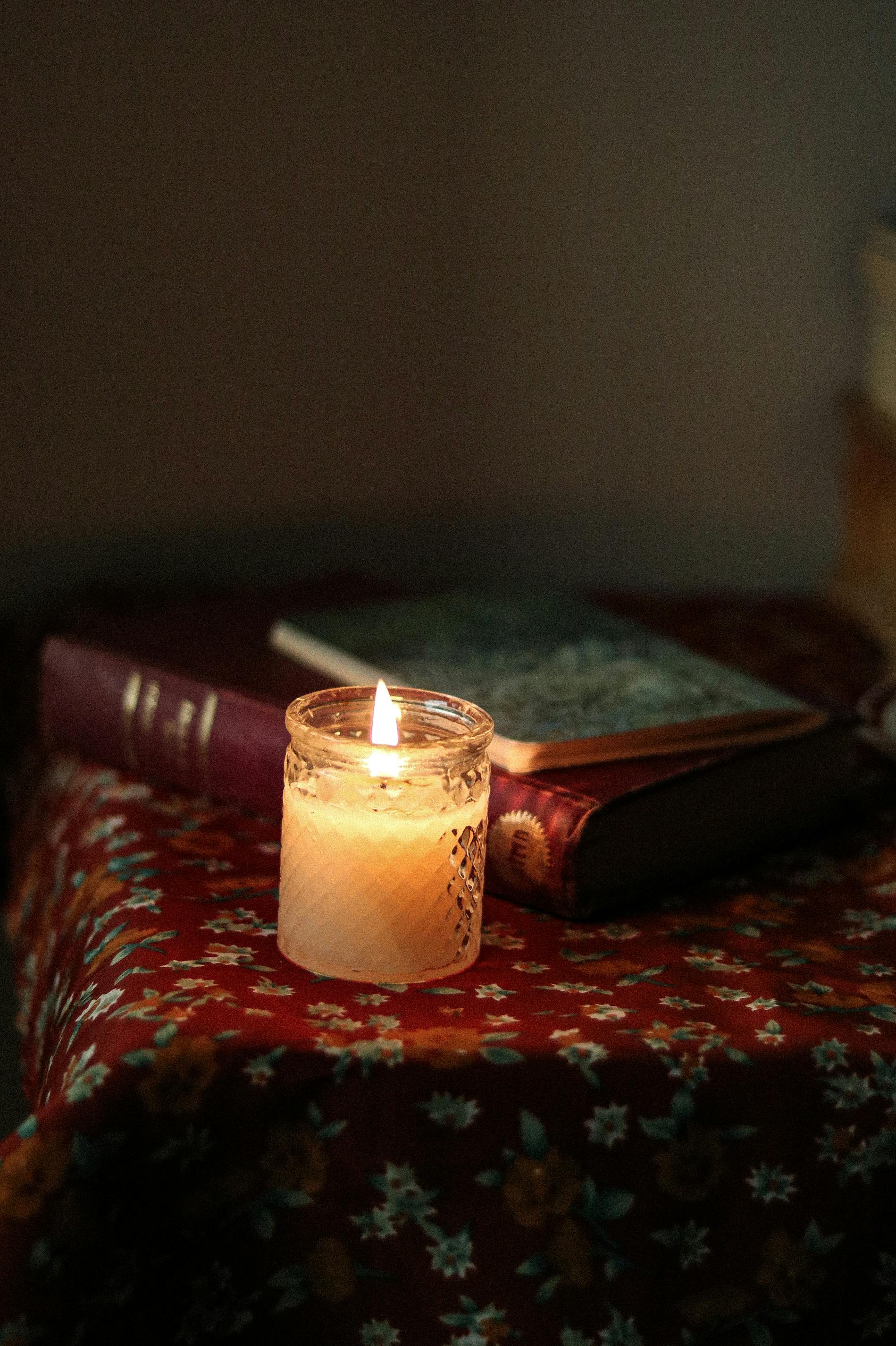 A Candle and a Book on a Table · Free Stock Photo