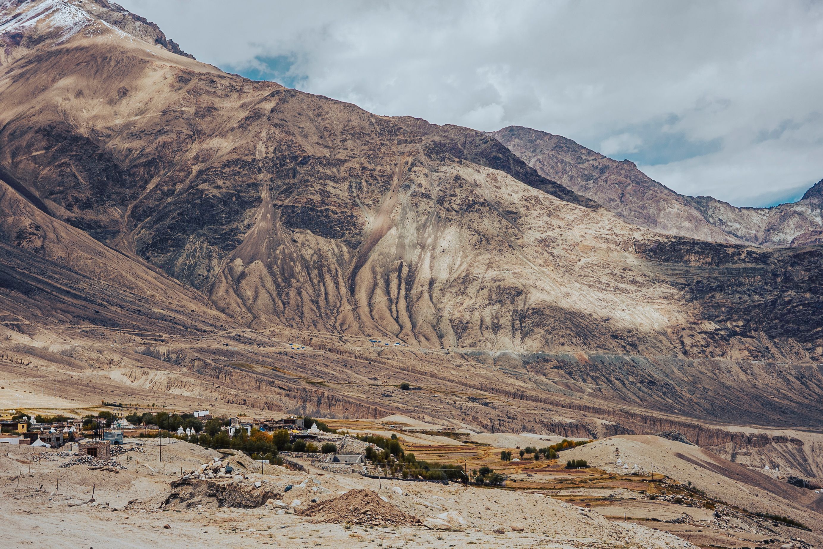 Landscape of Large Mountains and Houses in the Valley · Free Stock Photo