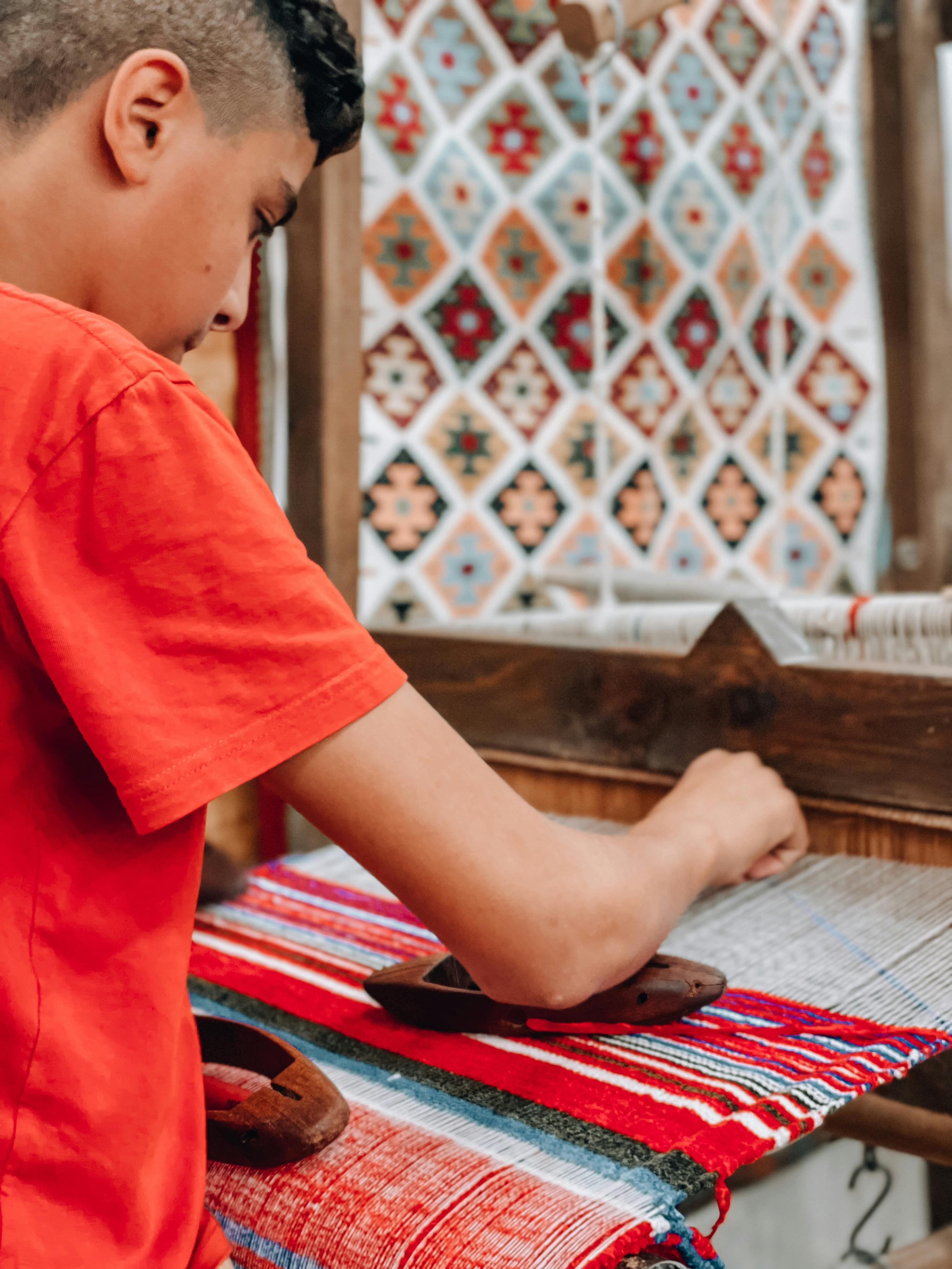 A Man Using a Loom · Free Stock Photo