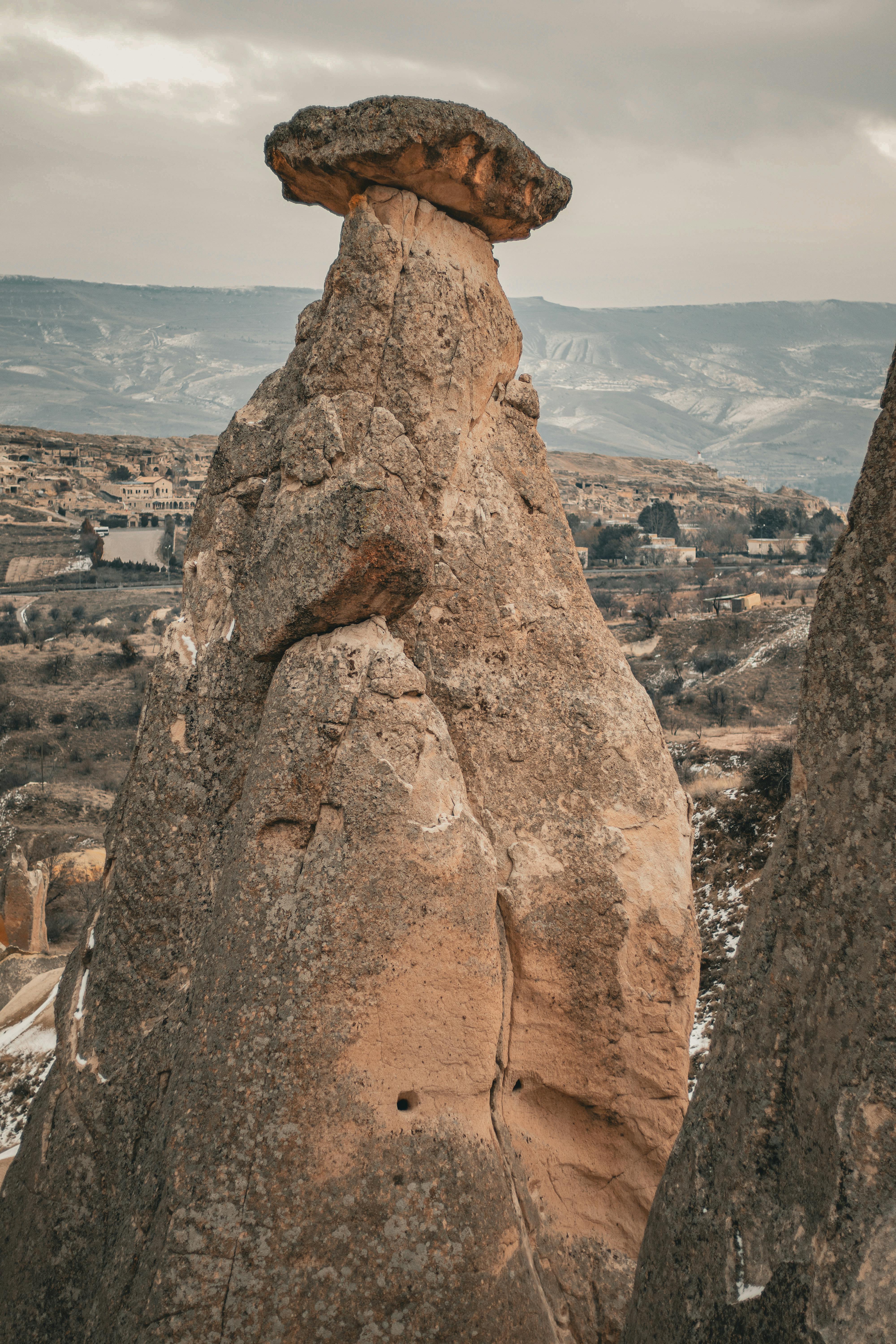 A person standing on top of a rock formation · Free Stock Photo
